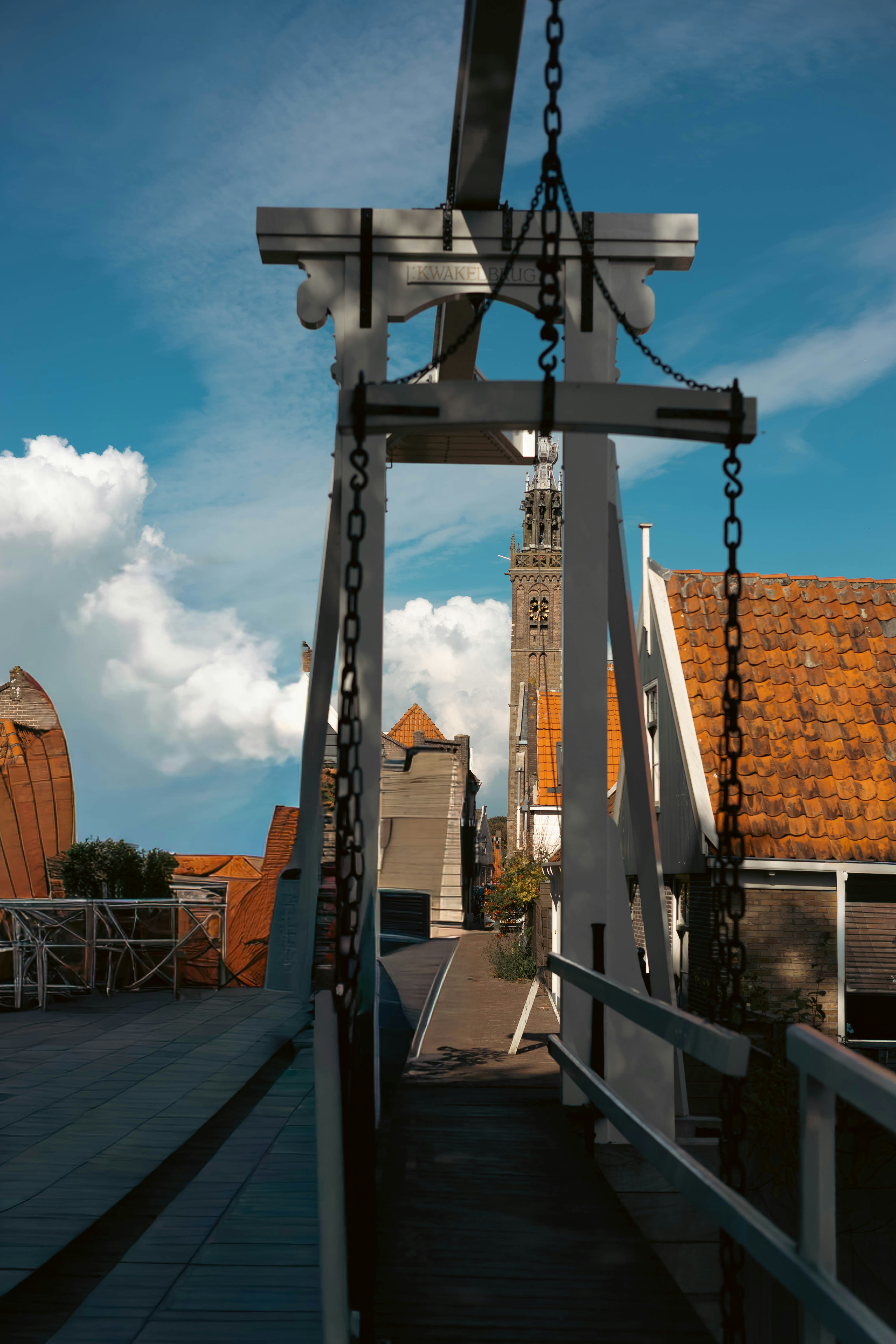 Rooftop Swing Bridge toward a Gothic Spire
