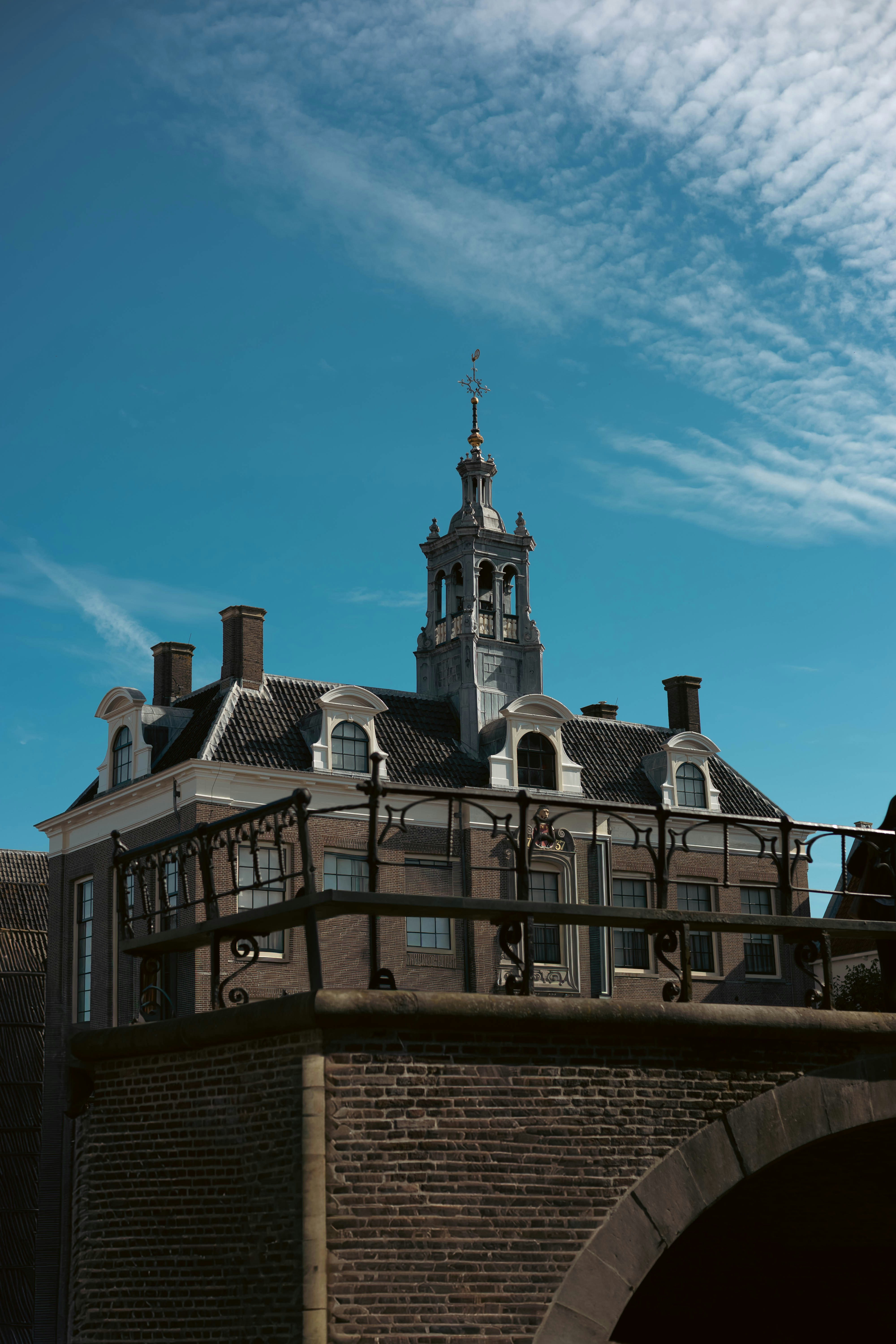 Heritage Rooftop: A Clocktower Silhouette Against a Clear Sky