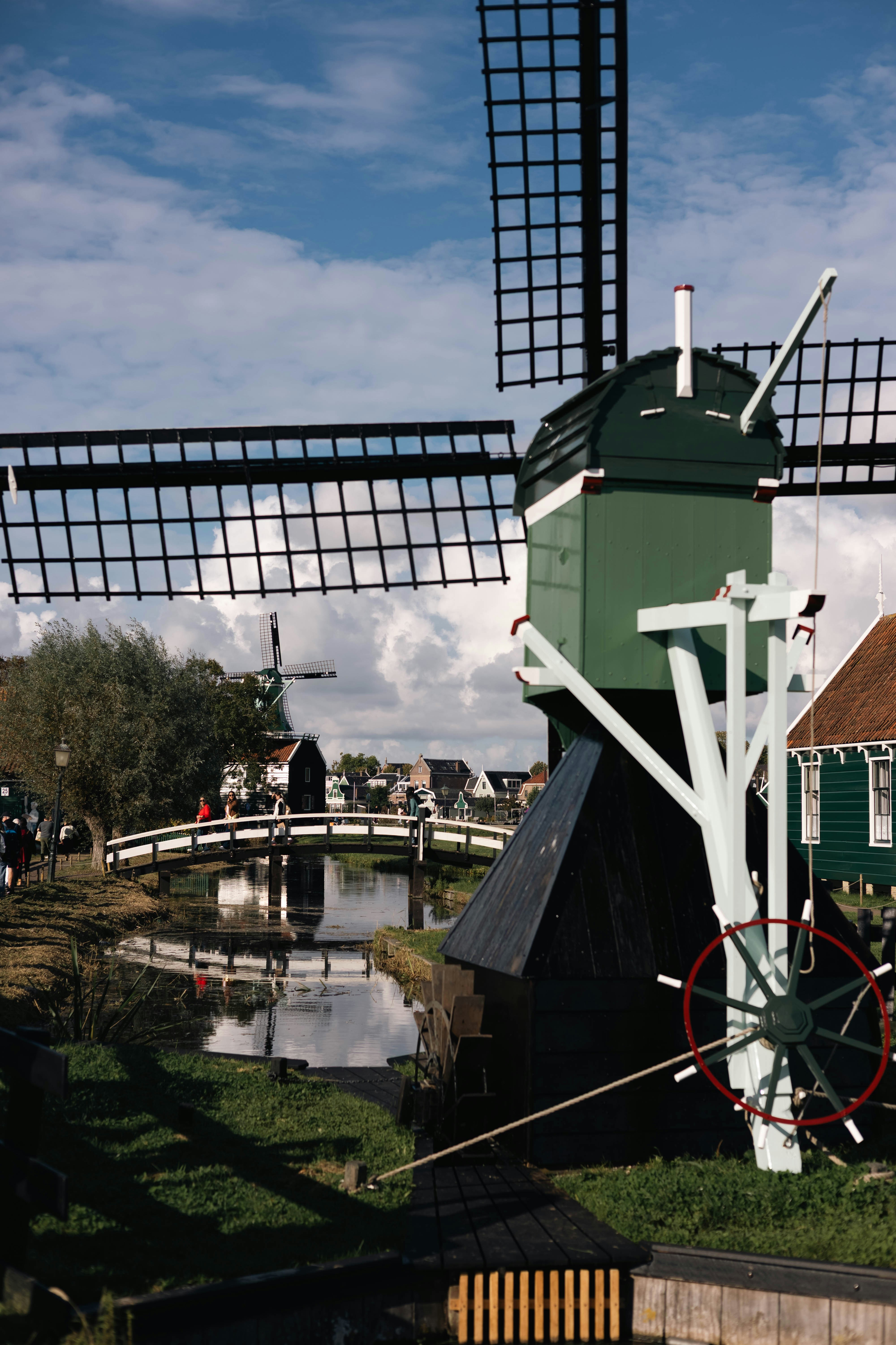 Windmill in Balance: A Quiet Dutch Scene by the Canal