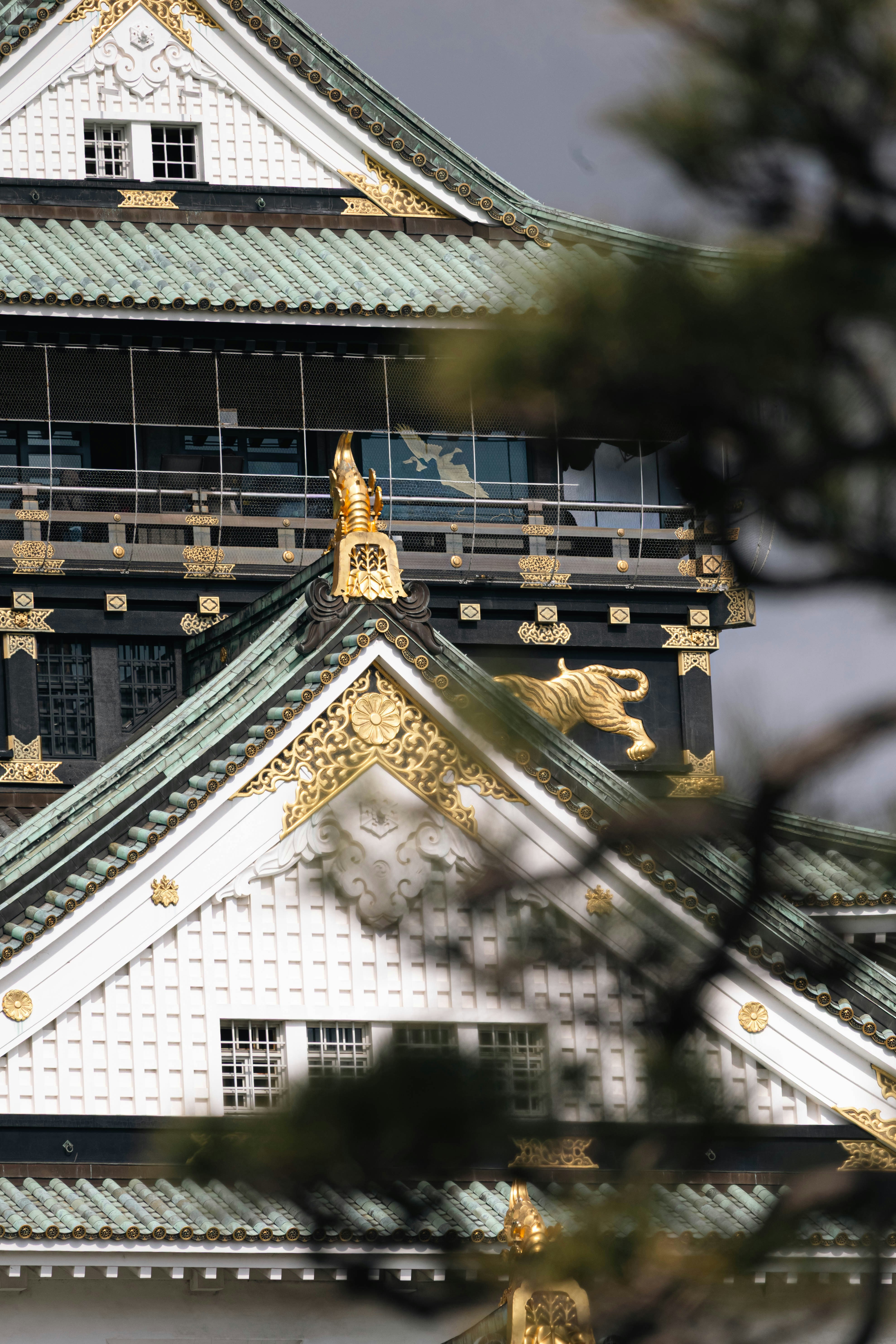 Elaborate japanese castle with golden tiger ornaments