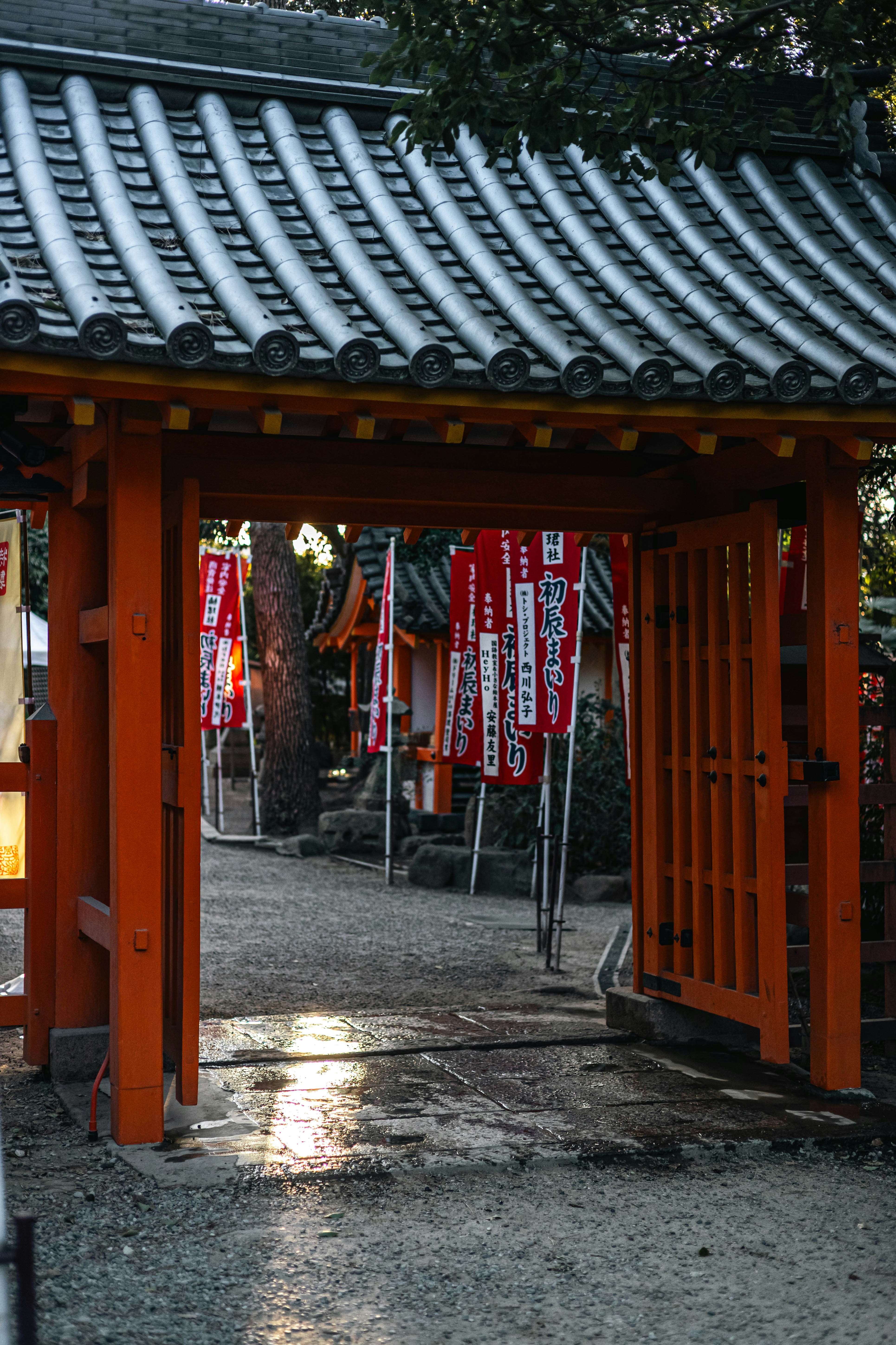 Gateway to Quiet Shrine: Red Torii and Bannered Path