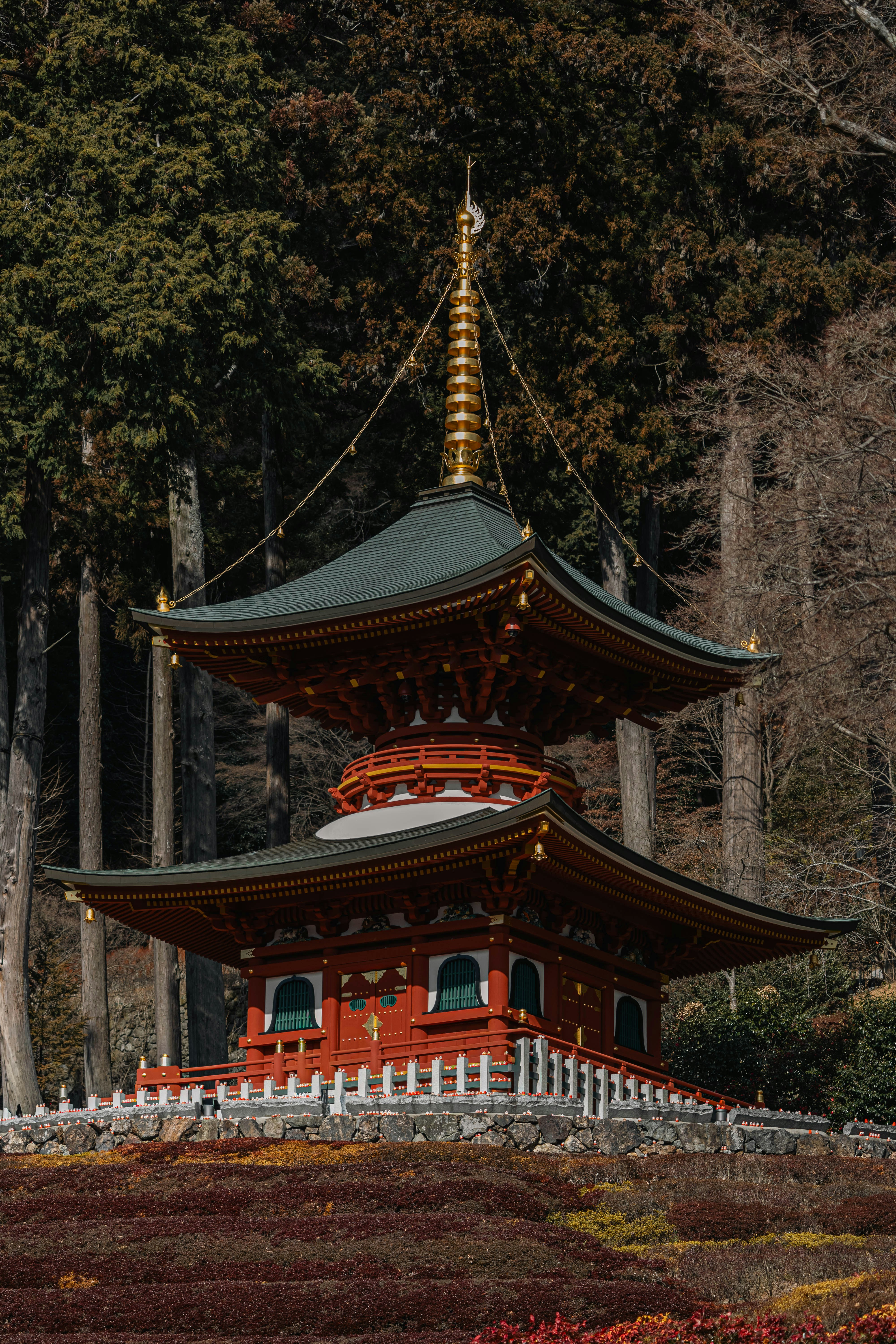 Red Pagoda in a Forest Clearing