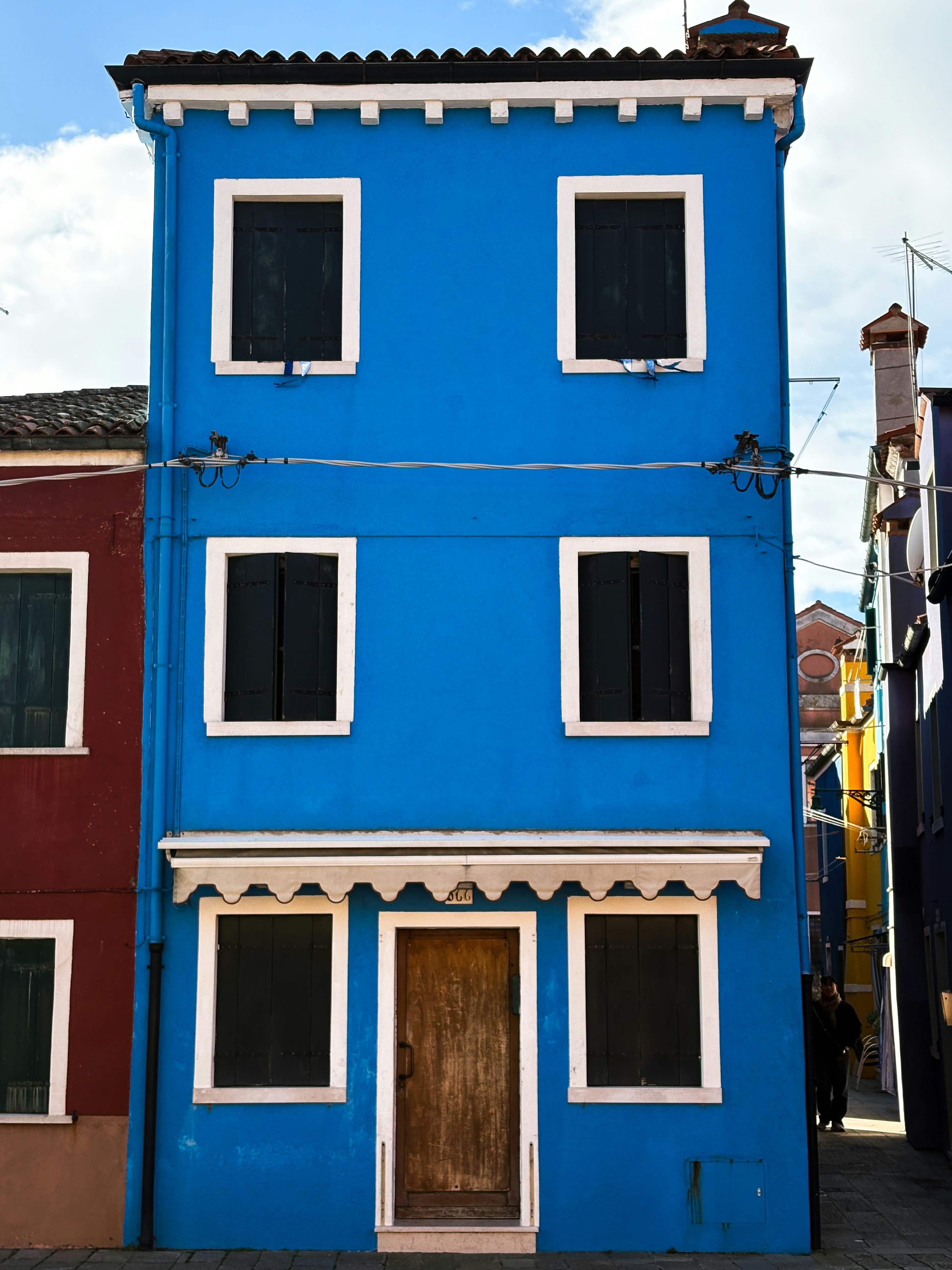 Azure Facade: A Quiet Blue House in a Colorful Calle
