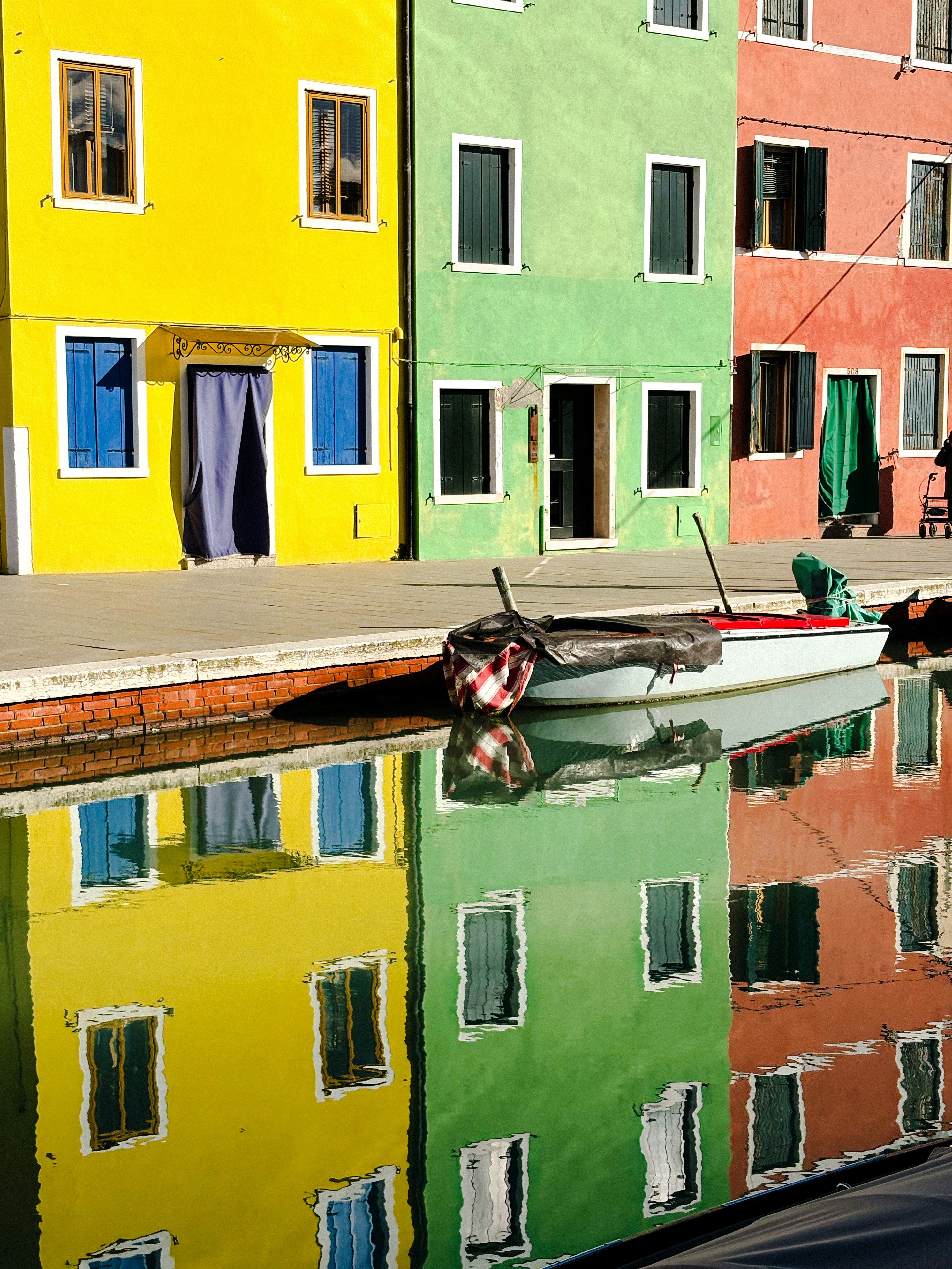 Bright Row: A Canal-side Gallery of Sunlit Facades