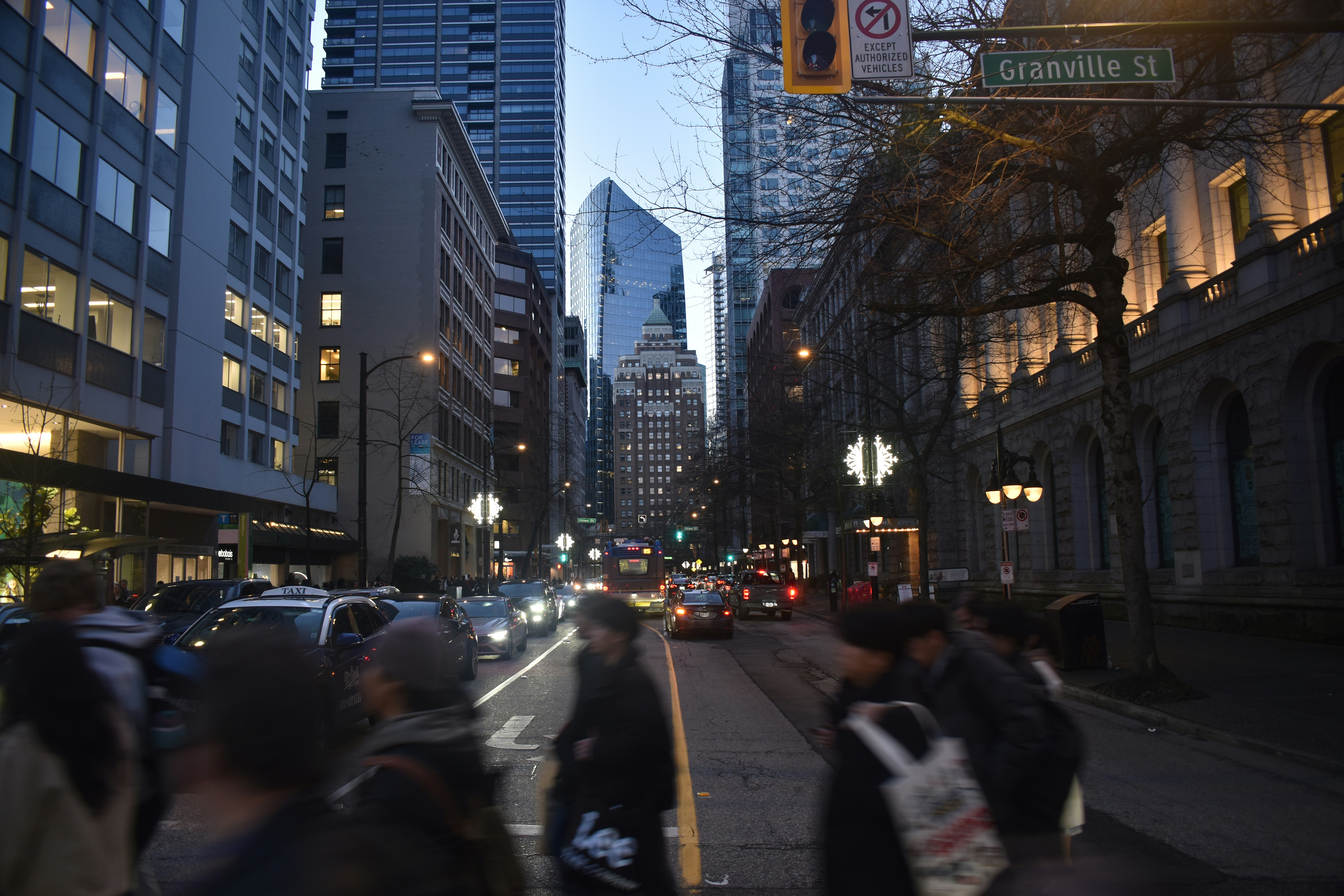 Midtown Pulse: Commuters Blur Beneath Glass Towers