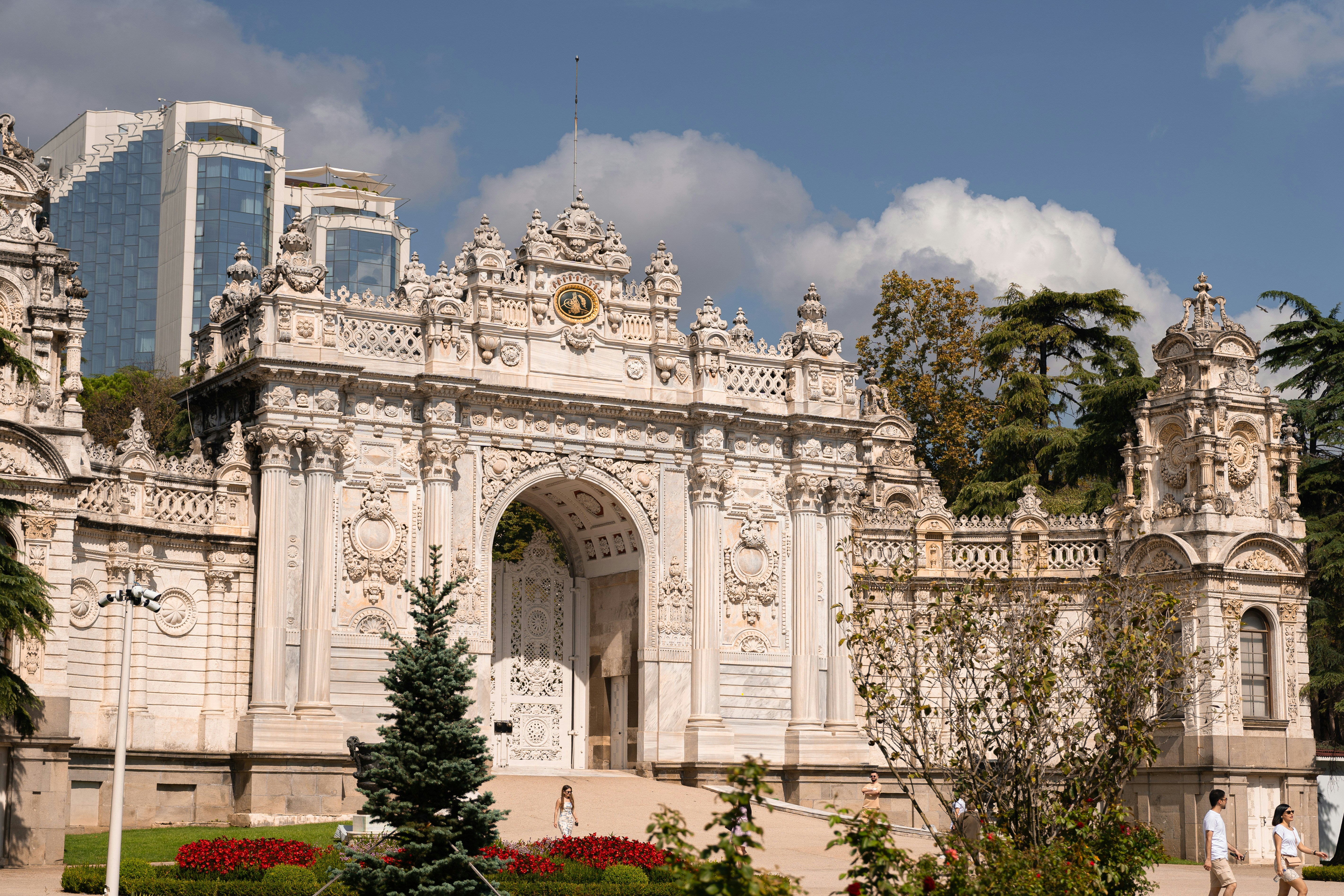 Granite Gate of an Opulent Terrace: Ornate Monument Framed by Modern Skyscrapers