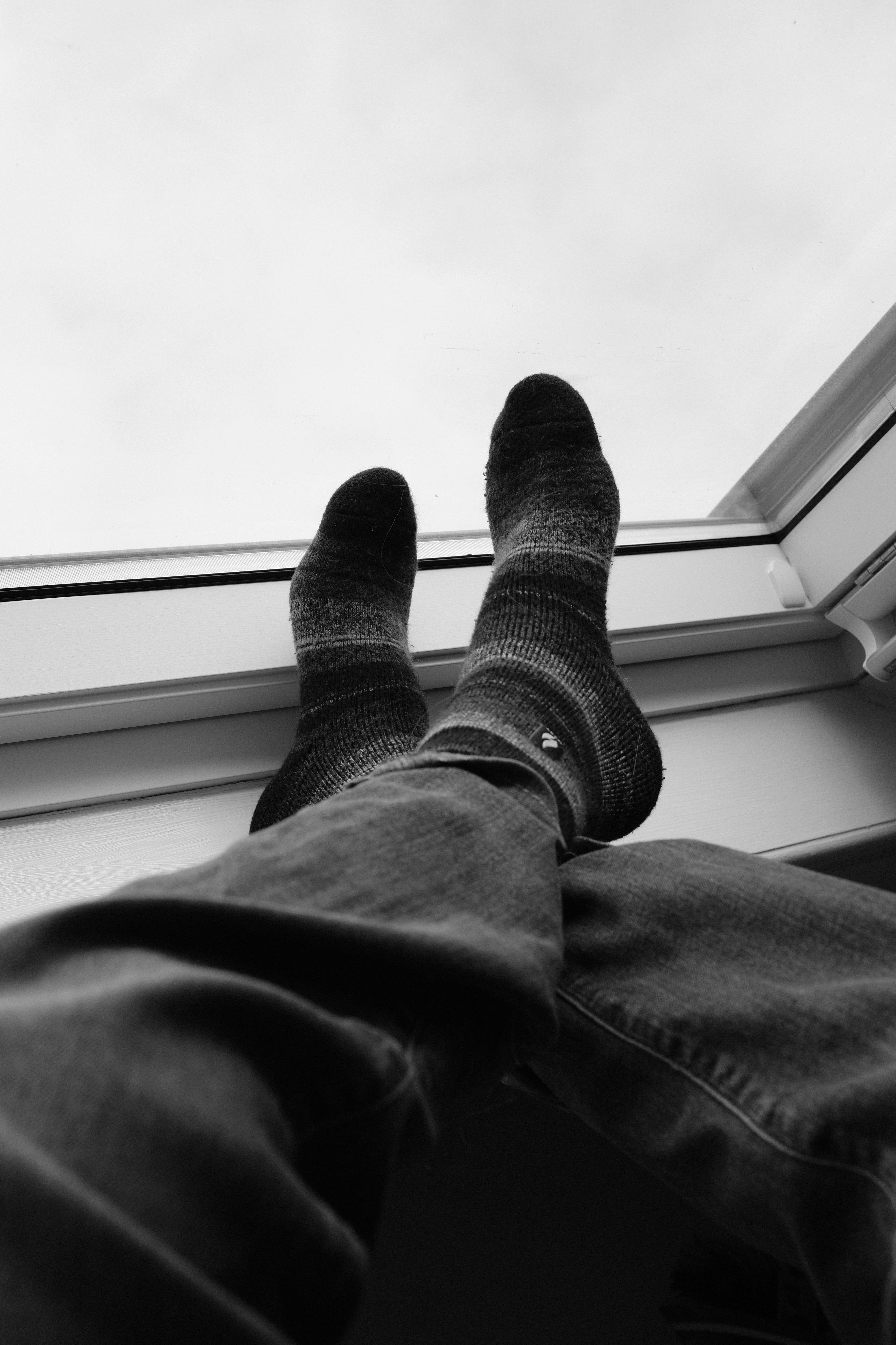 Feet at the Window: Quiet Moments with Dark Socks