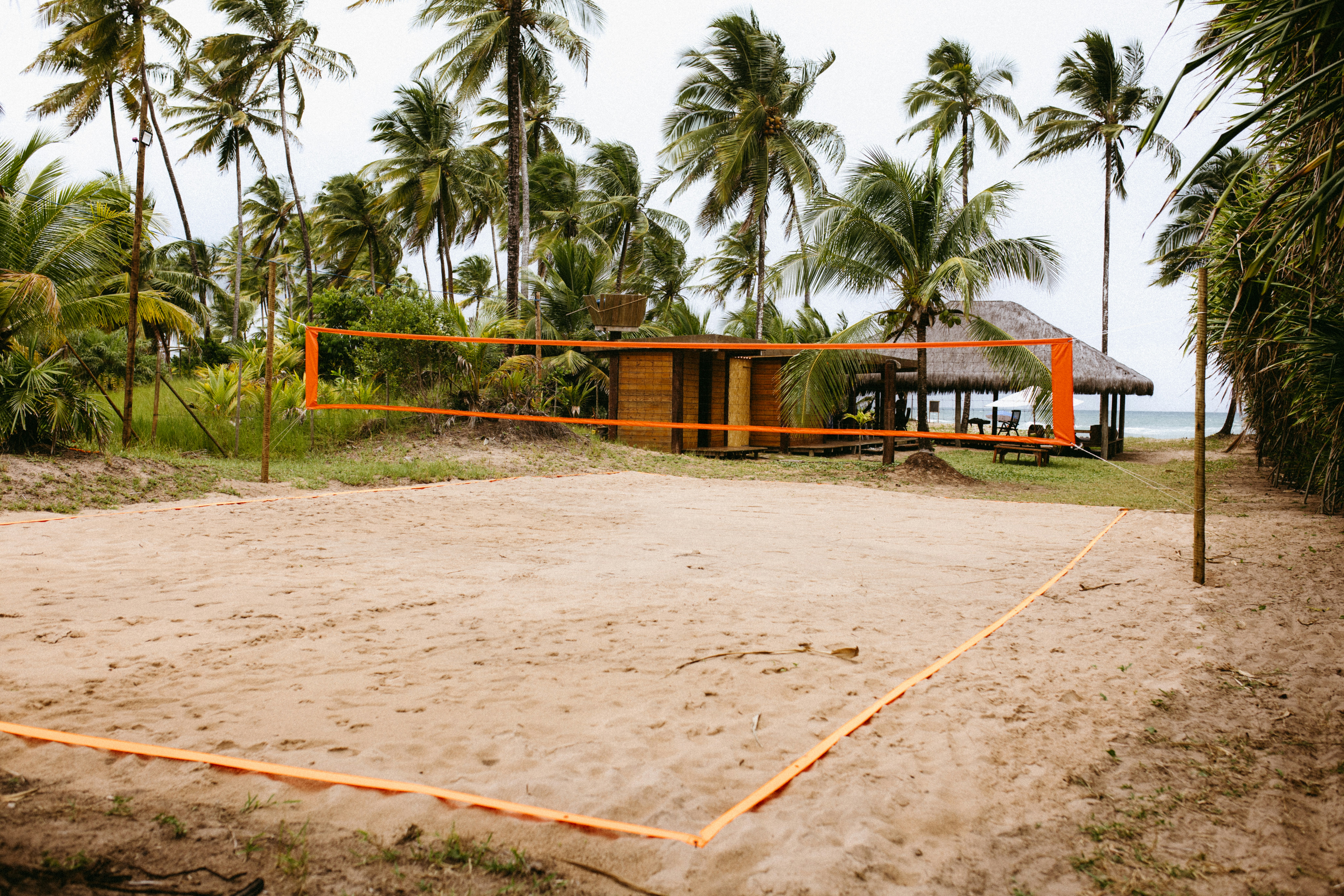 Beach Volleyball Court Outlines Frame a Tropical Beach House