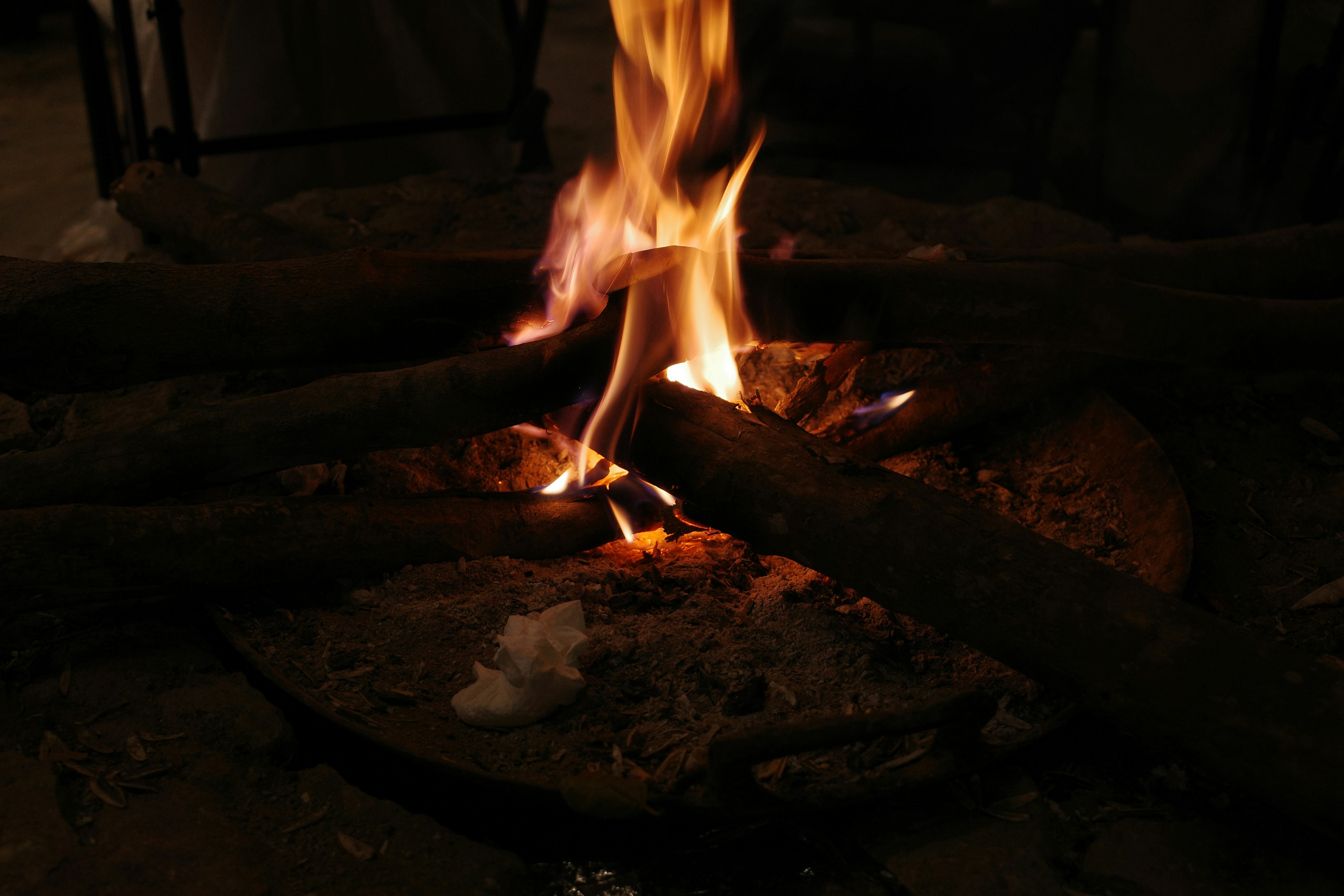 Embers and Echoes: A Quiet Campfire Scene in Low Light