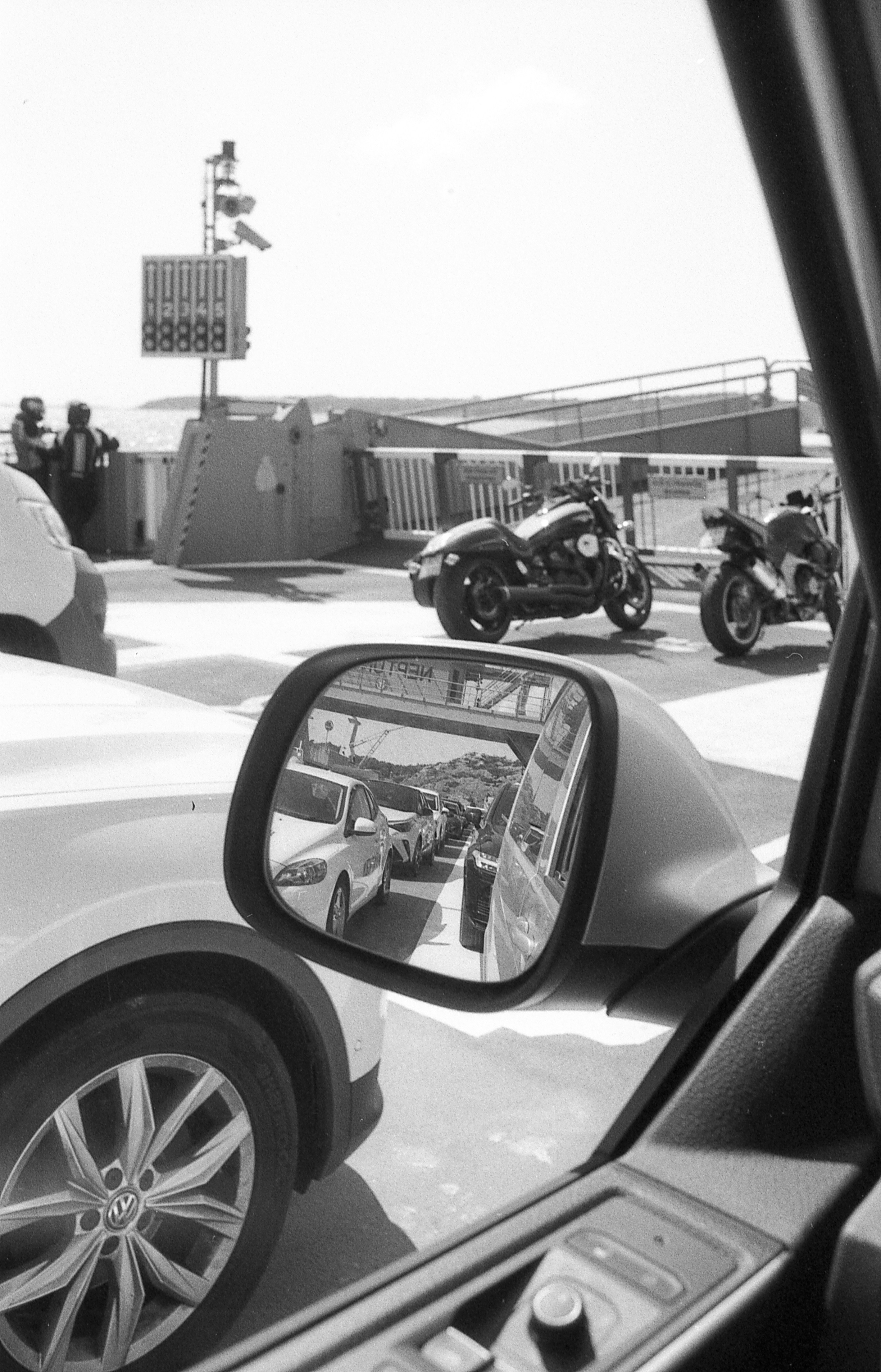 Cars and motorcycles on a ferry deck