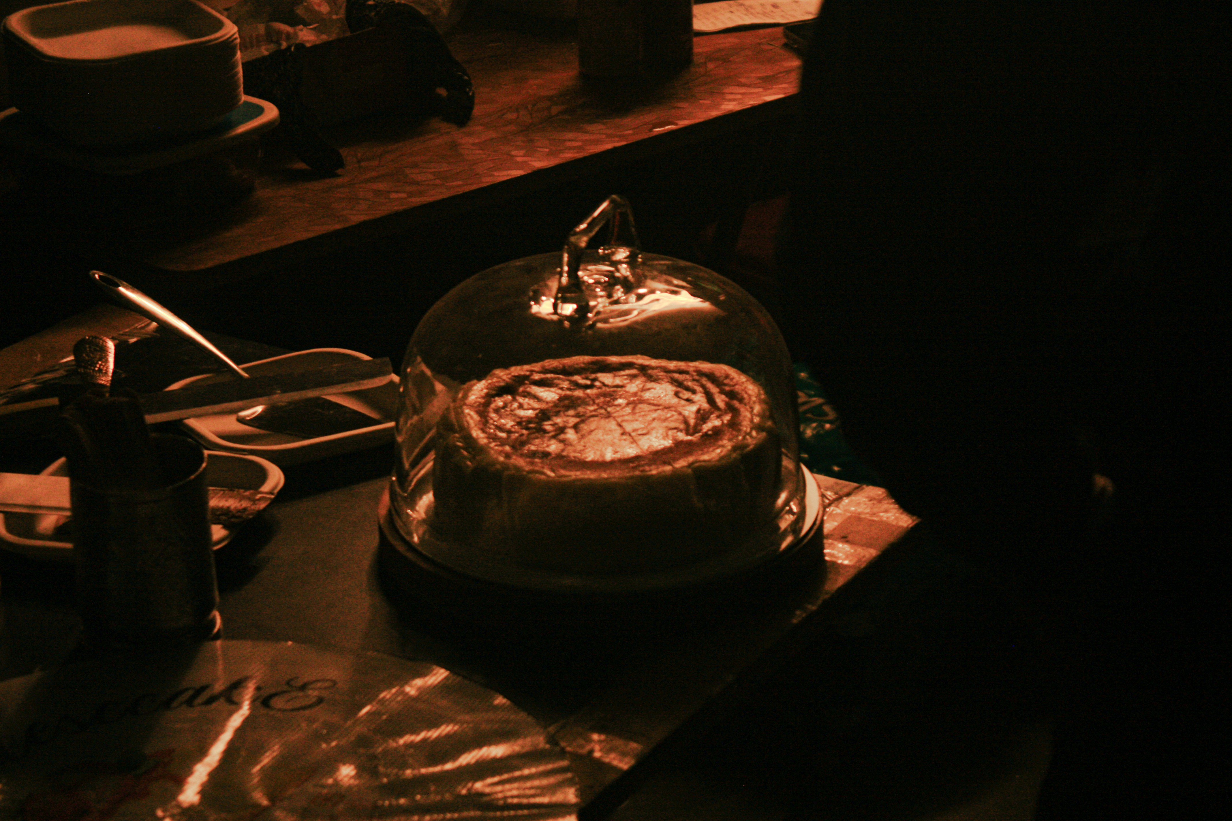 Amber-Glowed Sizzle: A Cozy Bar Counter with a Covered Dessert