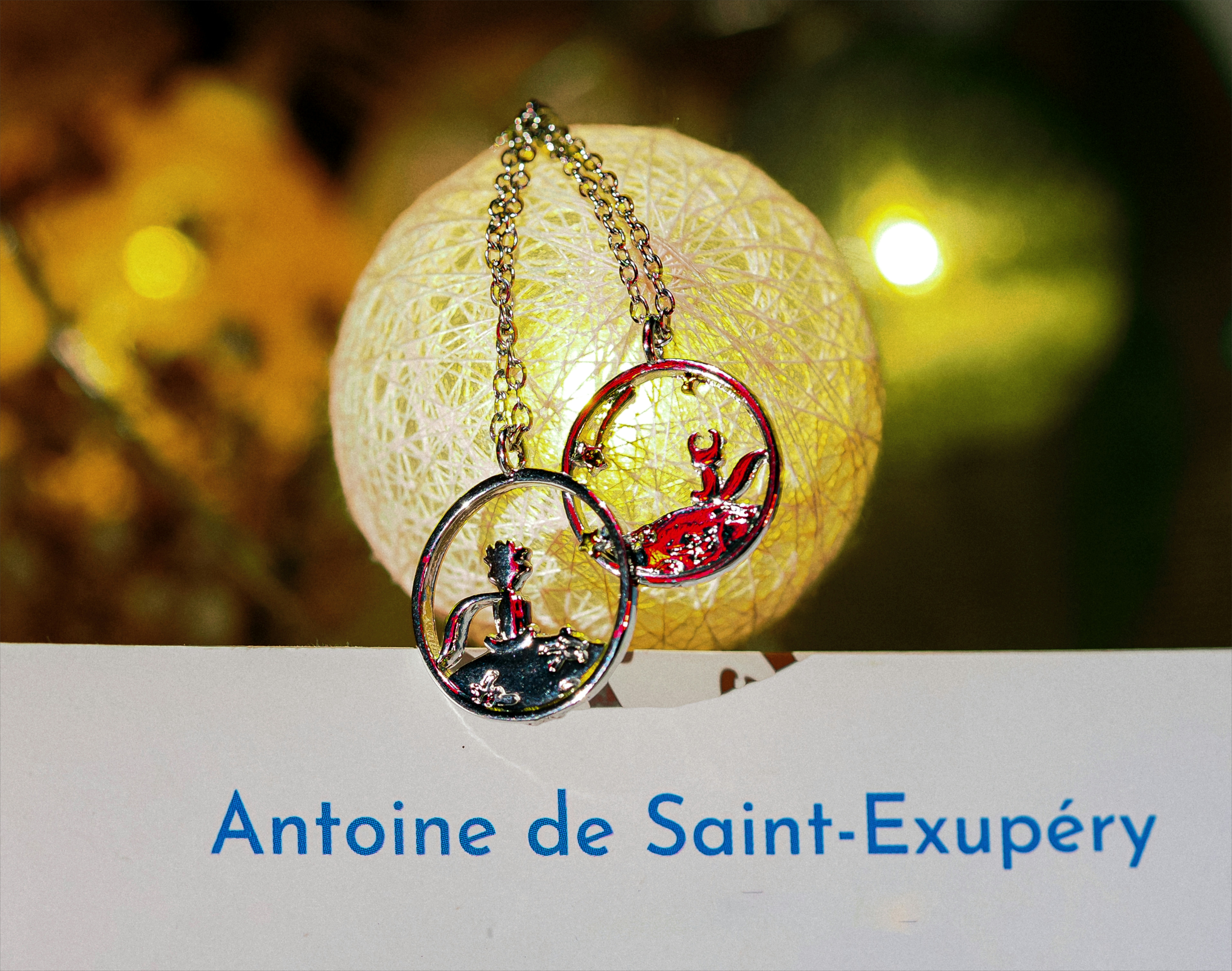 Lanterns of Love: Circular Charms Hover Over a Card