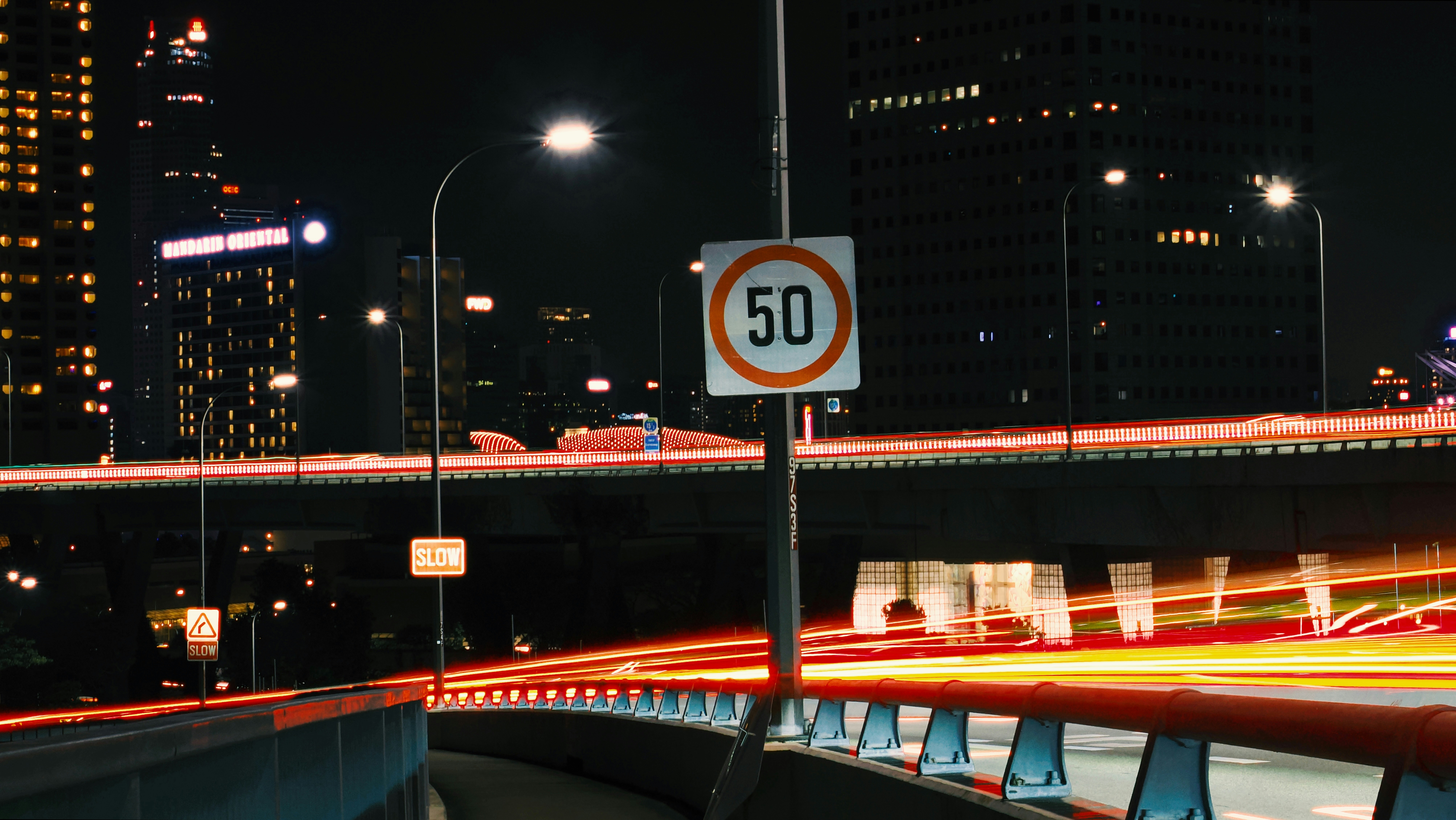 Night Highway in Motion: A Neon Skyline Crossing