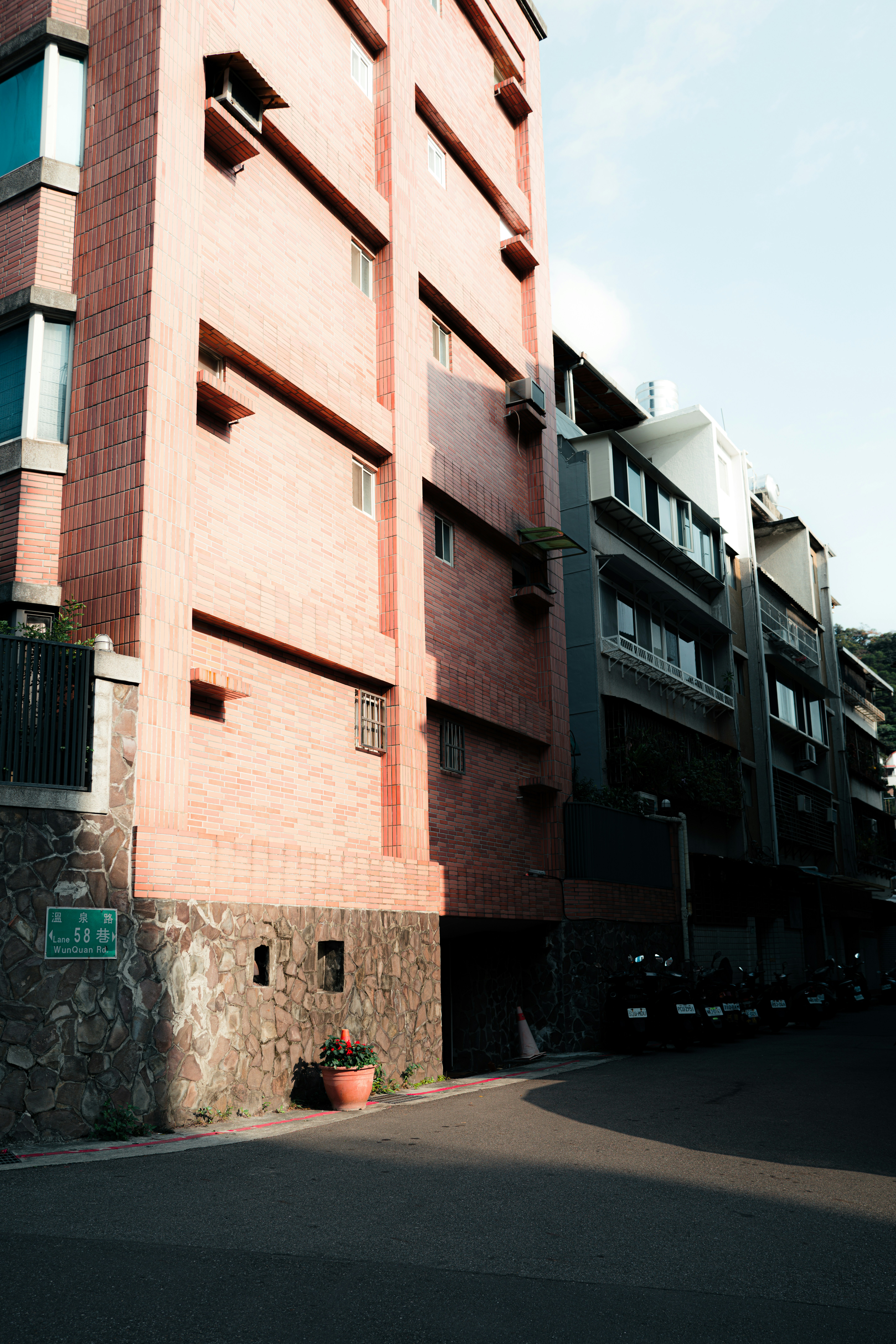 Red-Brick Corner: Quiet Street Shadowed by Architecture