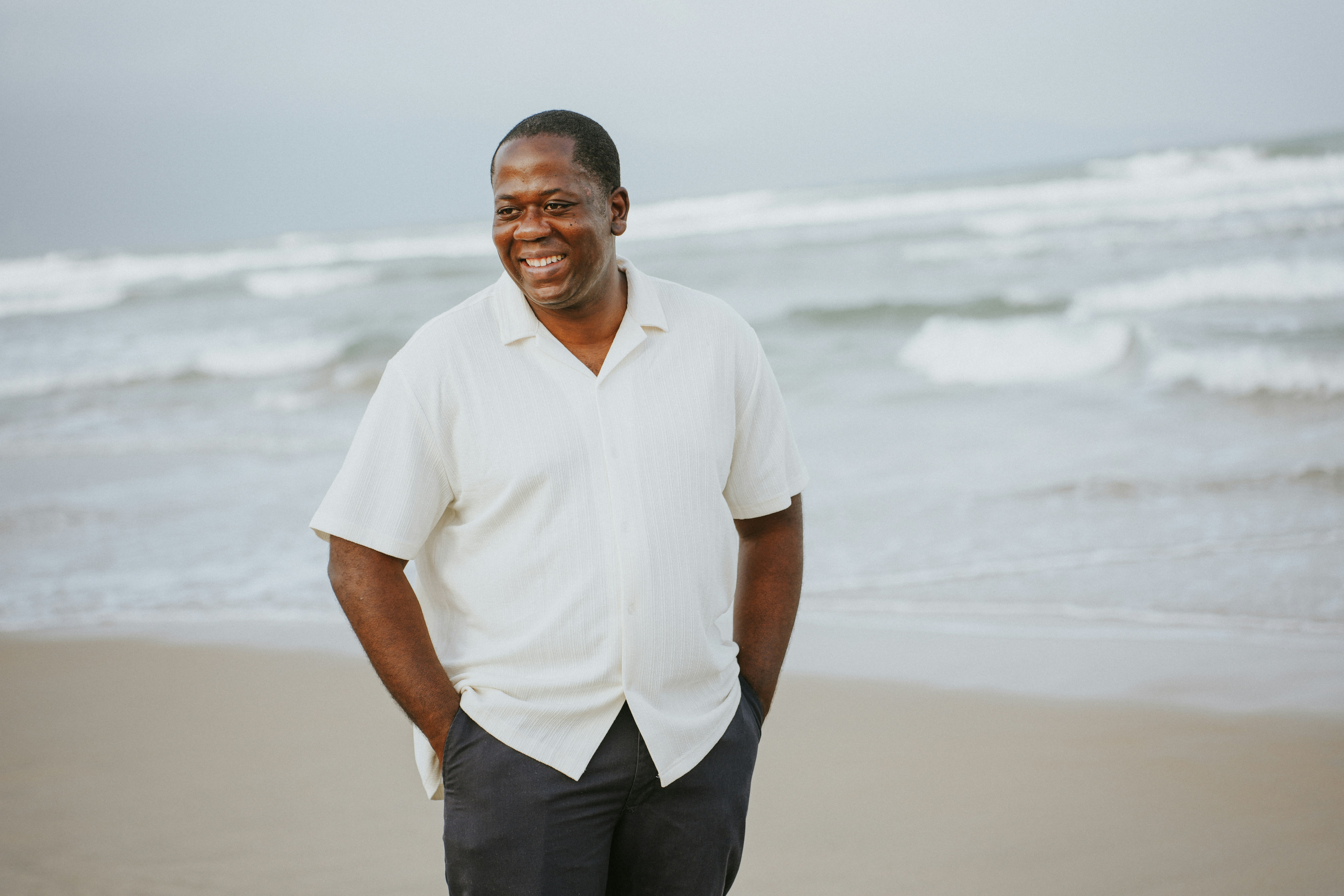 Coastal Confidence: A Relaxed Portrait on a Breezy Beach