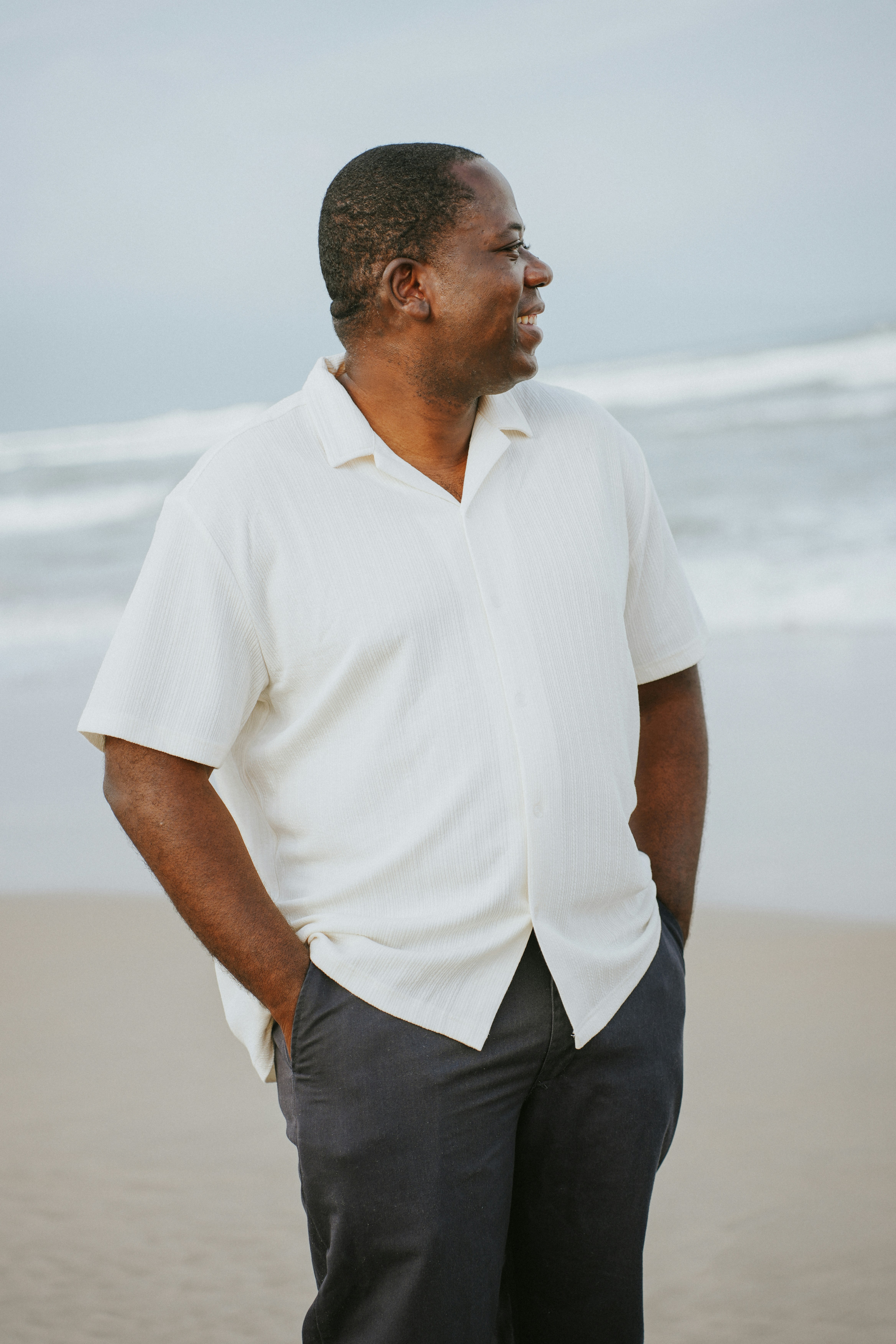 Confident Coastline Moment: A Gentleman in White at the Sea