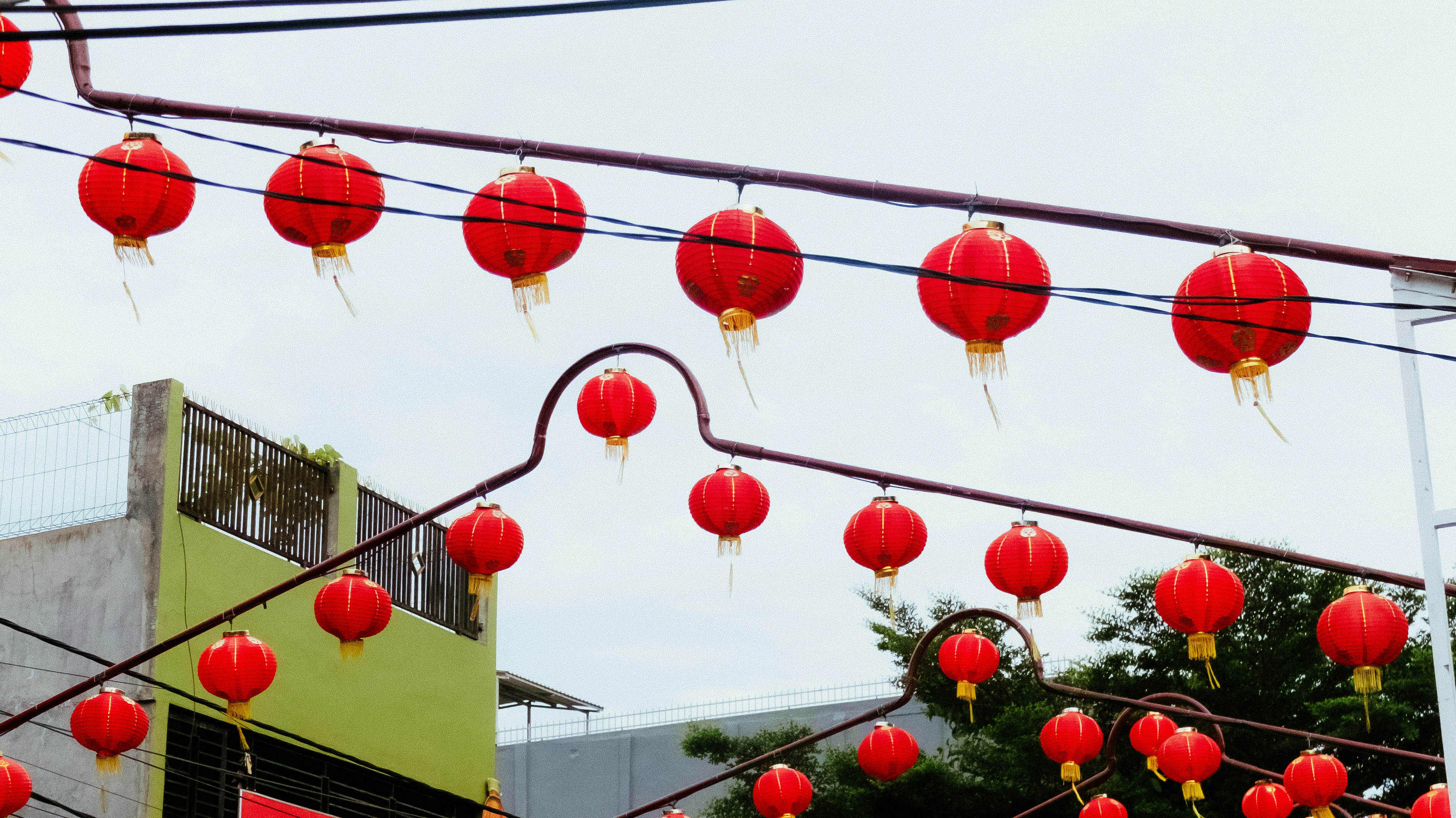 Red Lantern Rhythm Above the Street