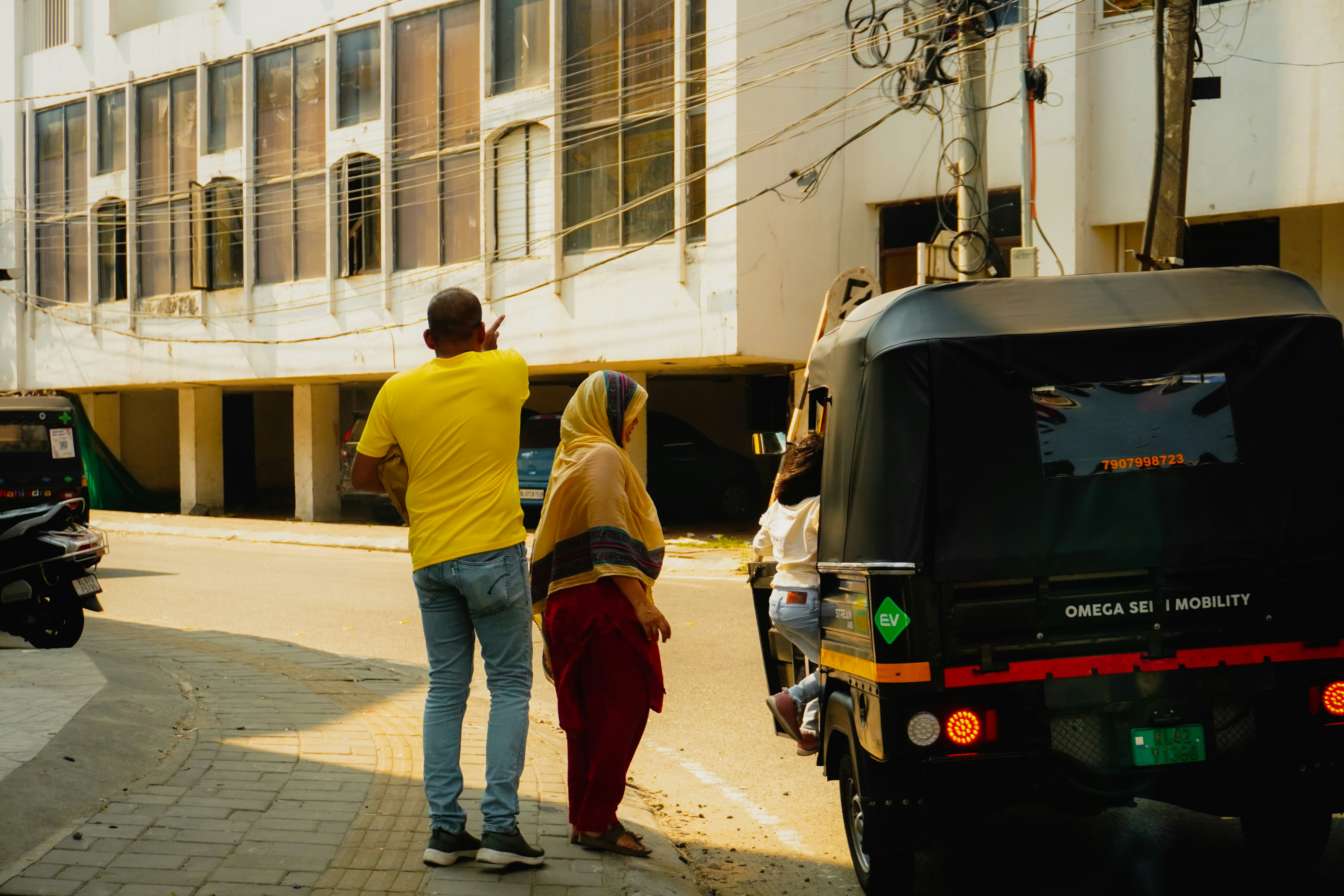Silhouette of a Pedestrian Reunion by a Sunlit Street