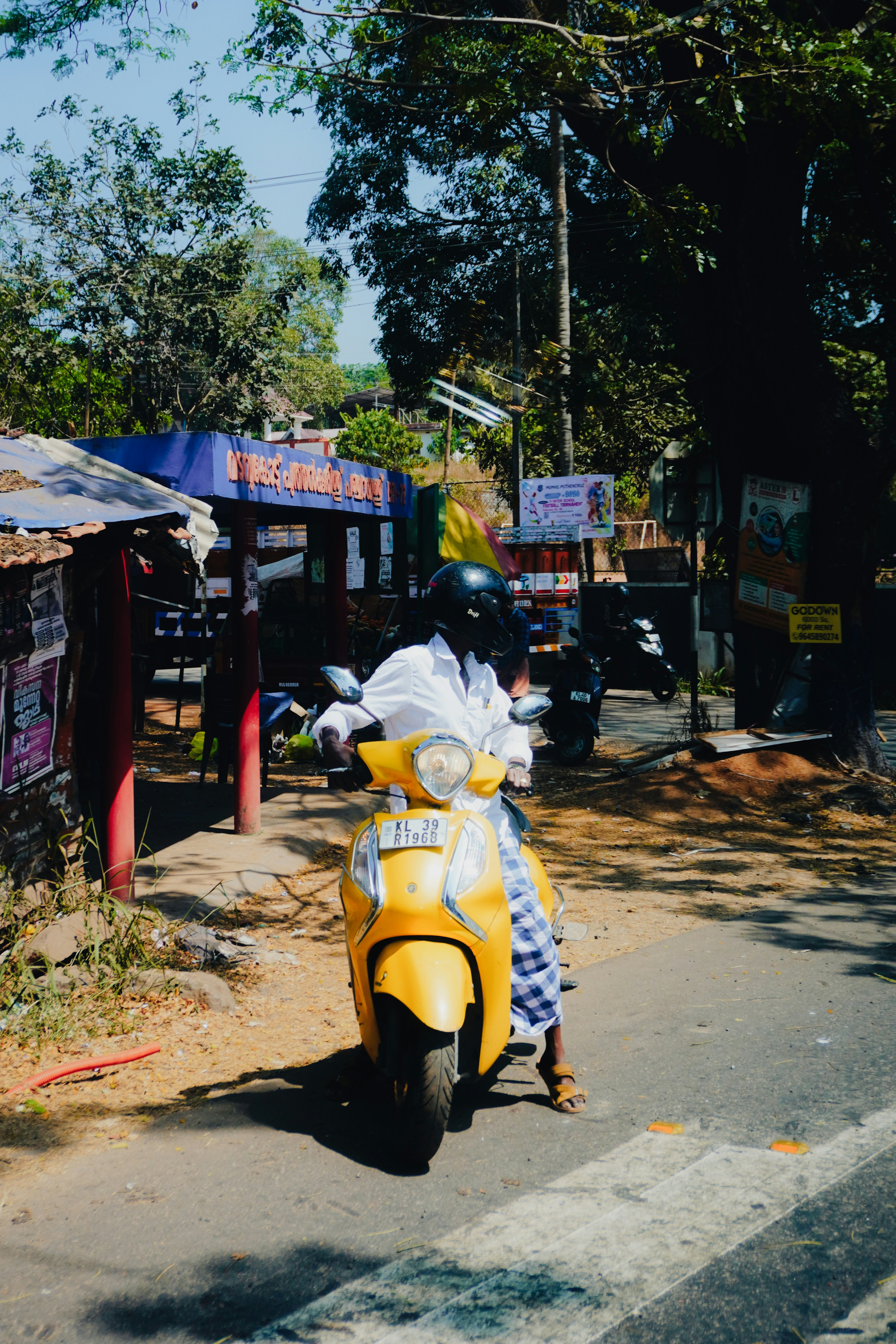Yellow Scooter at a Sunlit Street Corner