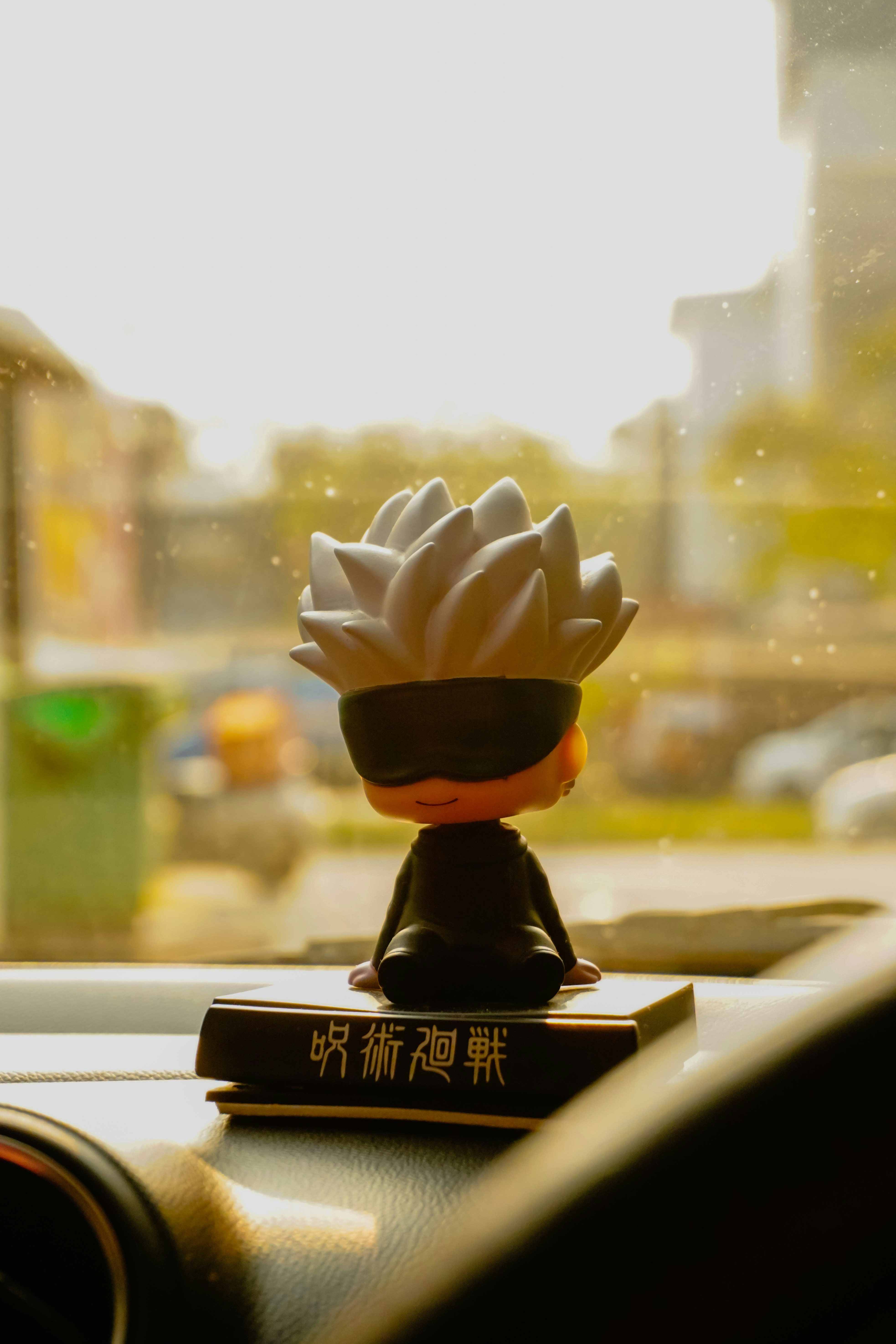 Tiny Figurine in Warm Car Dashboard Light
