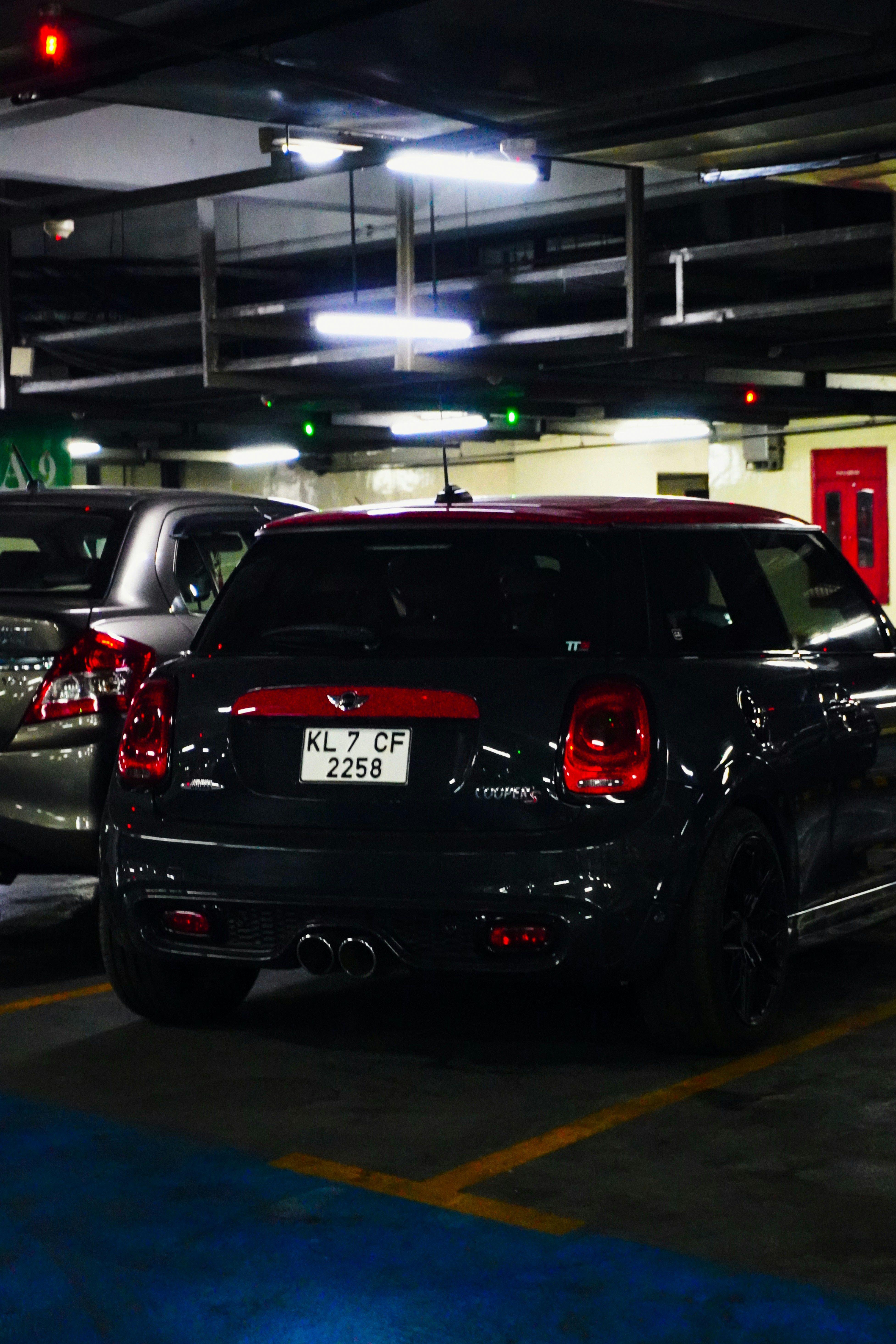 Midnight in the Parking: A Red-Top Mini in Deep Garage Light