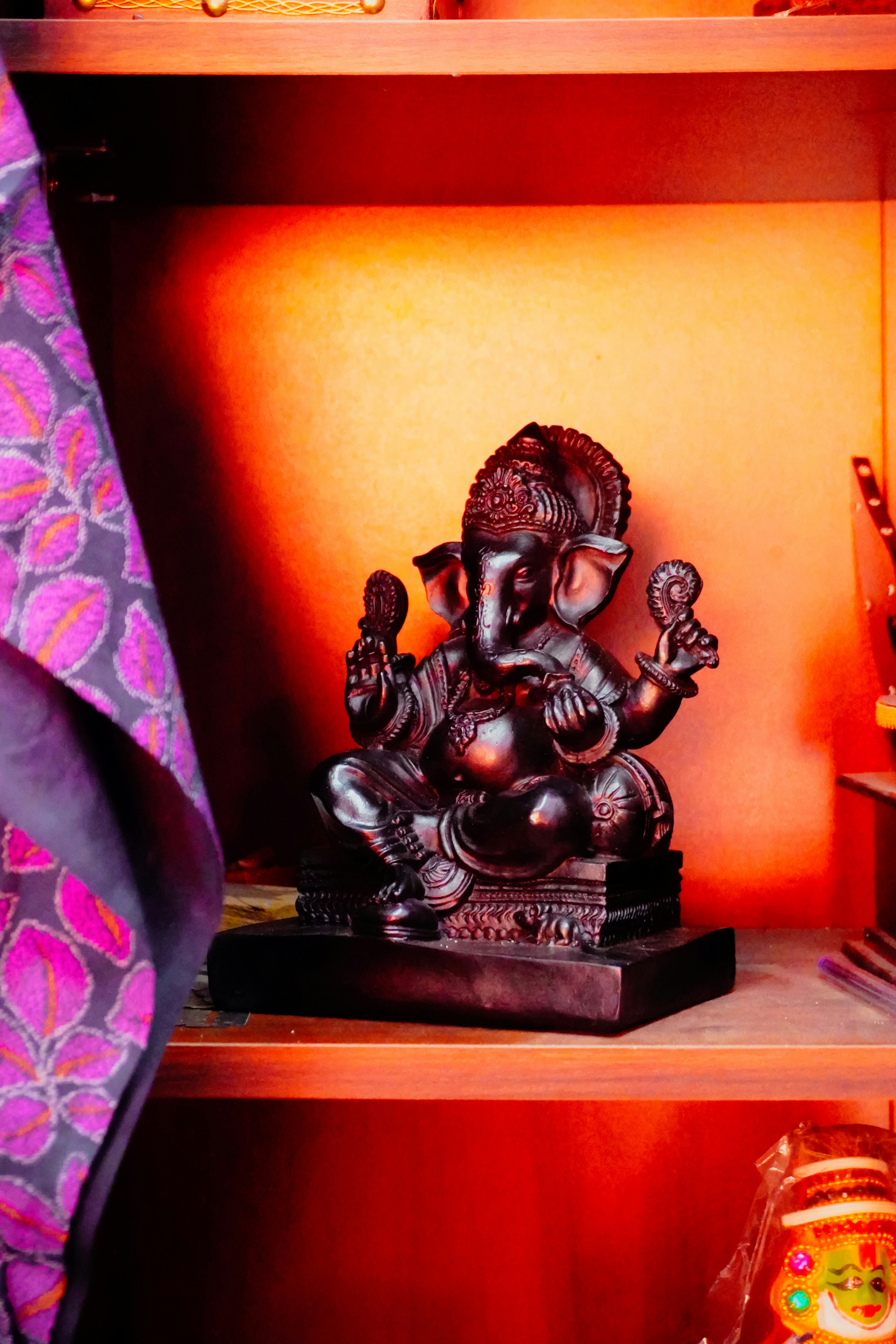 Gilded Ganesh in a Warm Cabinet