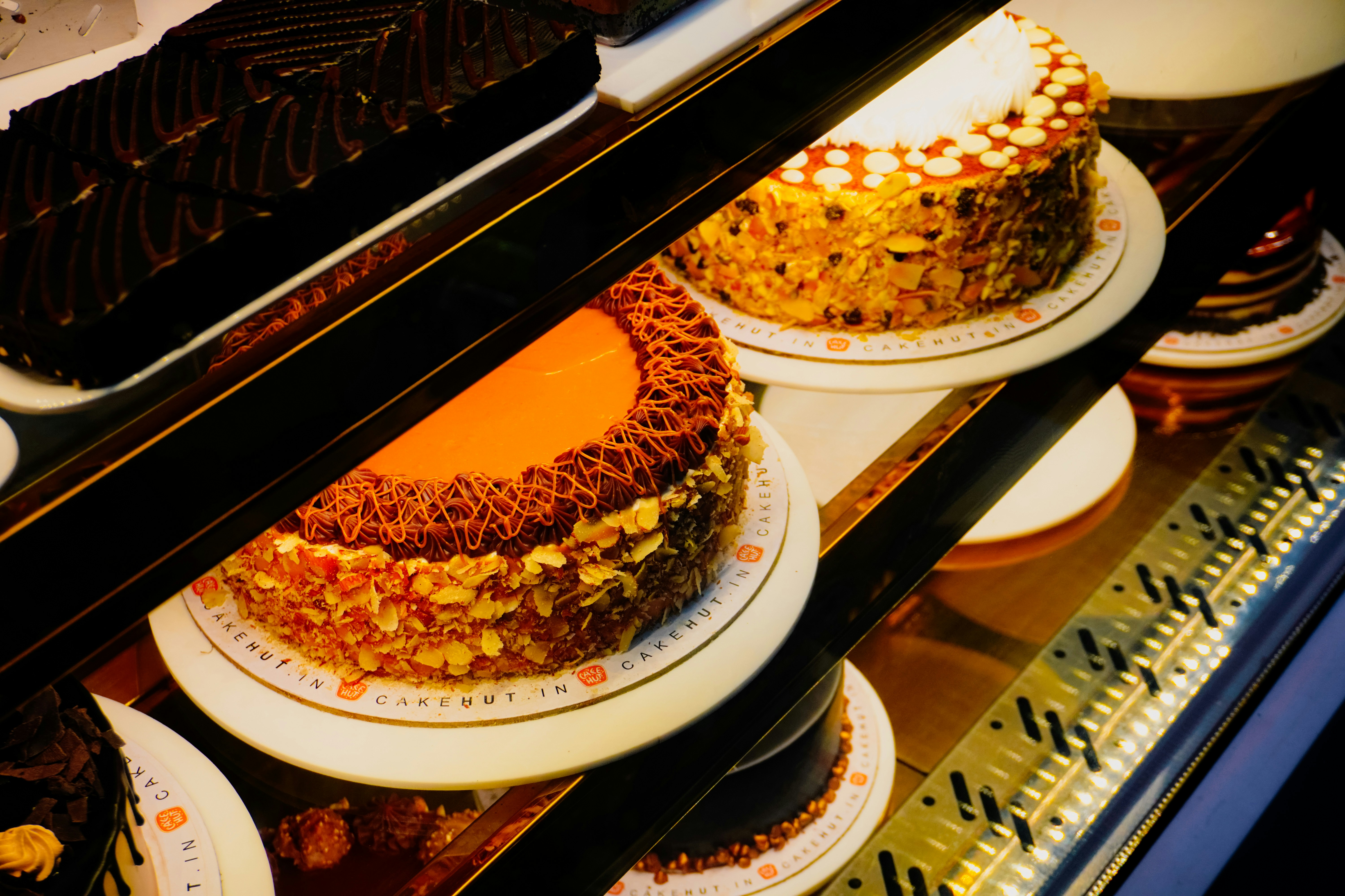 Tilted Display of Layered Cakes: Chocolate, Caramel, and Nut Crust Adventure