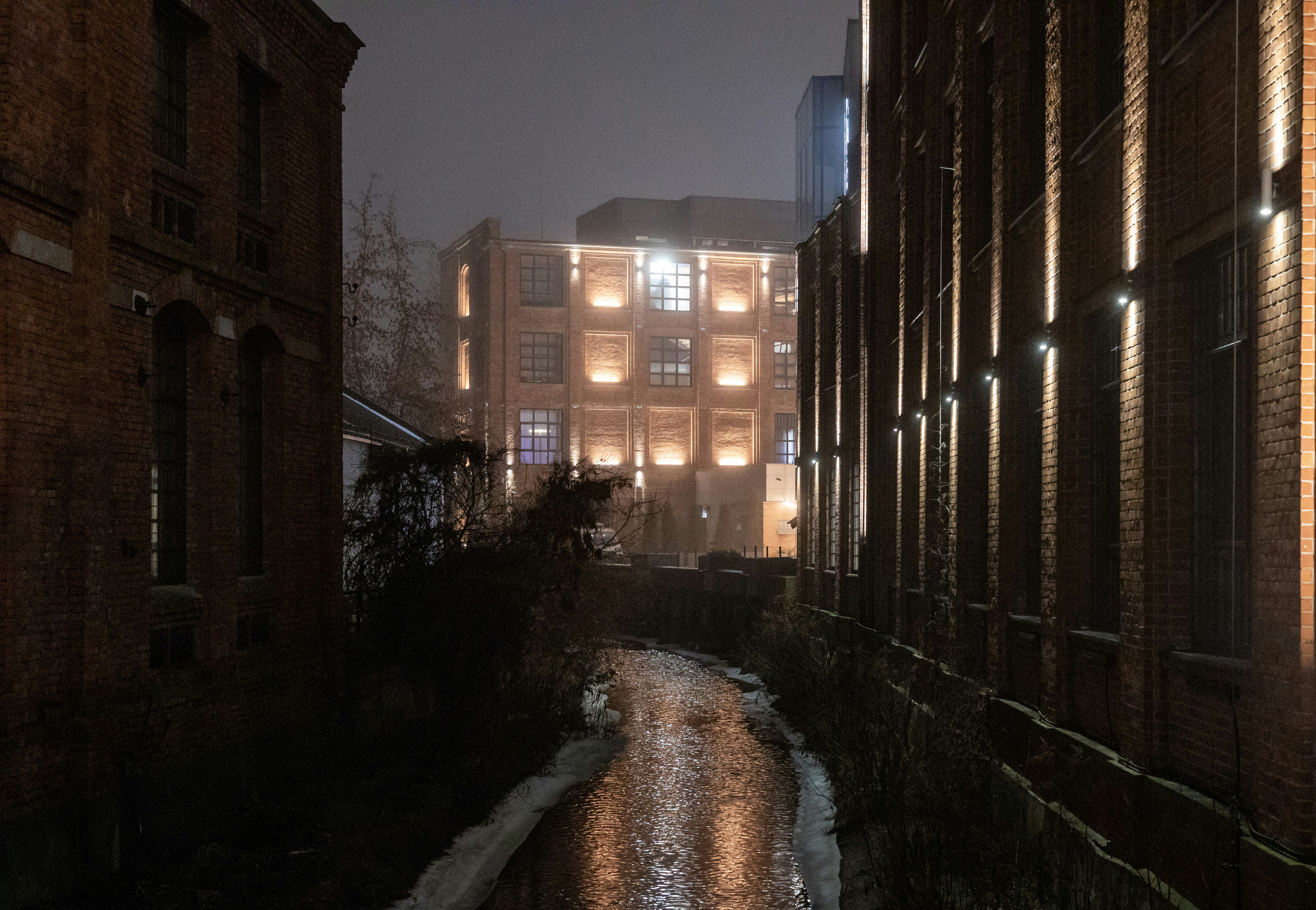Midnight Canal Between Brick Wings