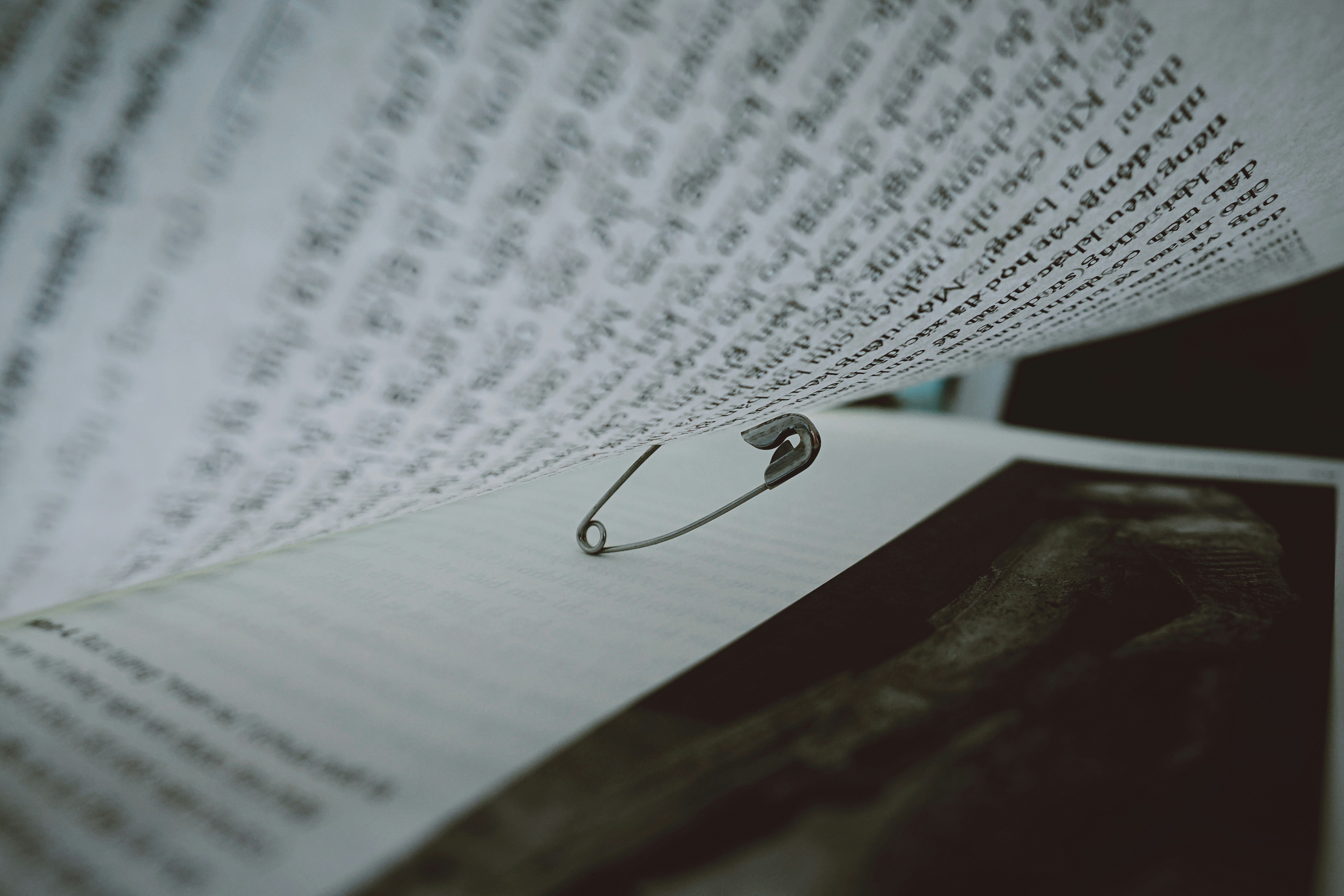 Under the Grey Page: A Loop of Paper and Ring