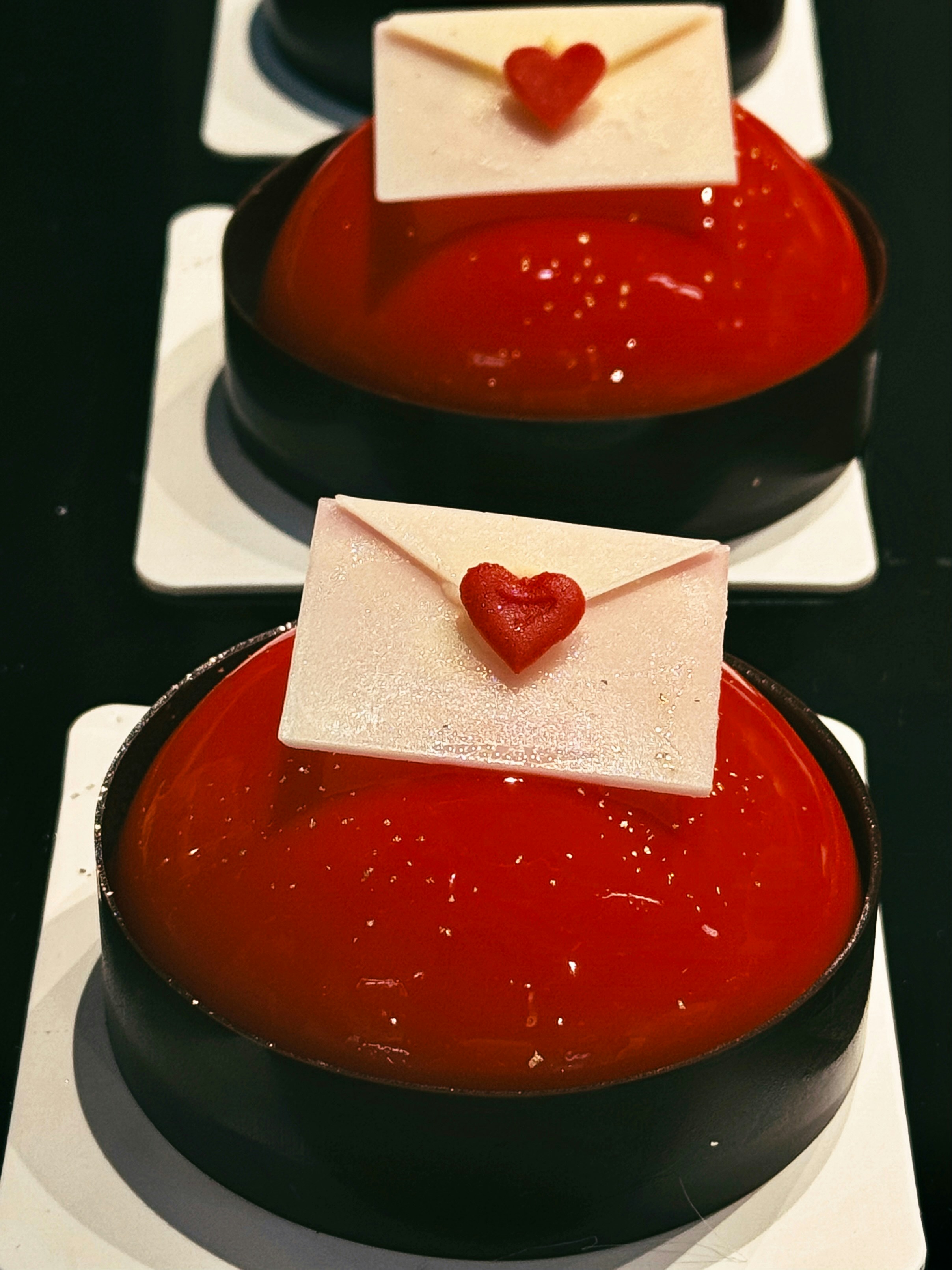 Valentine Minis: Glossy Red Desserts with White Heart Tags
