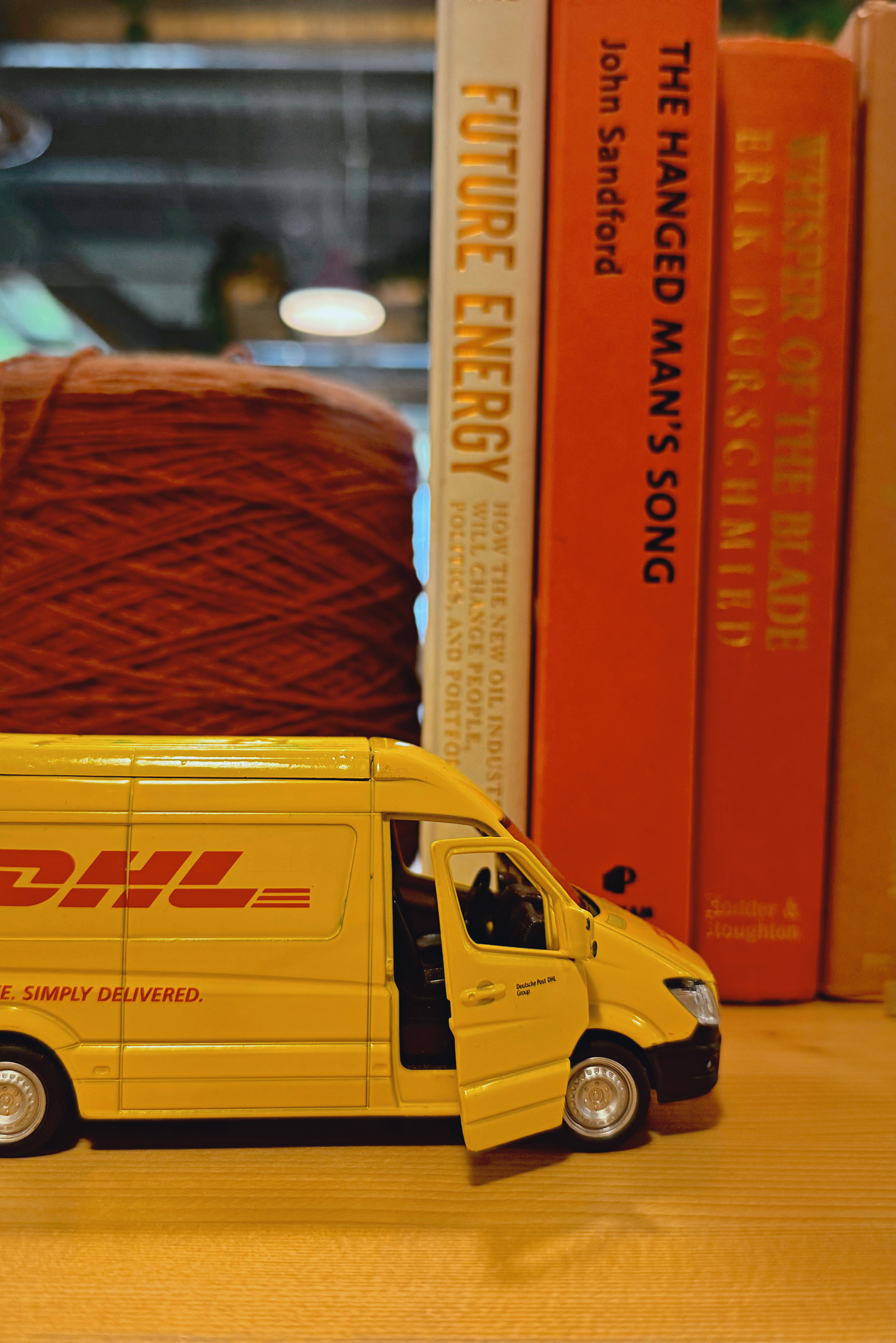 Miniature DHL Van in a Bookshelf City