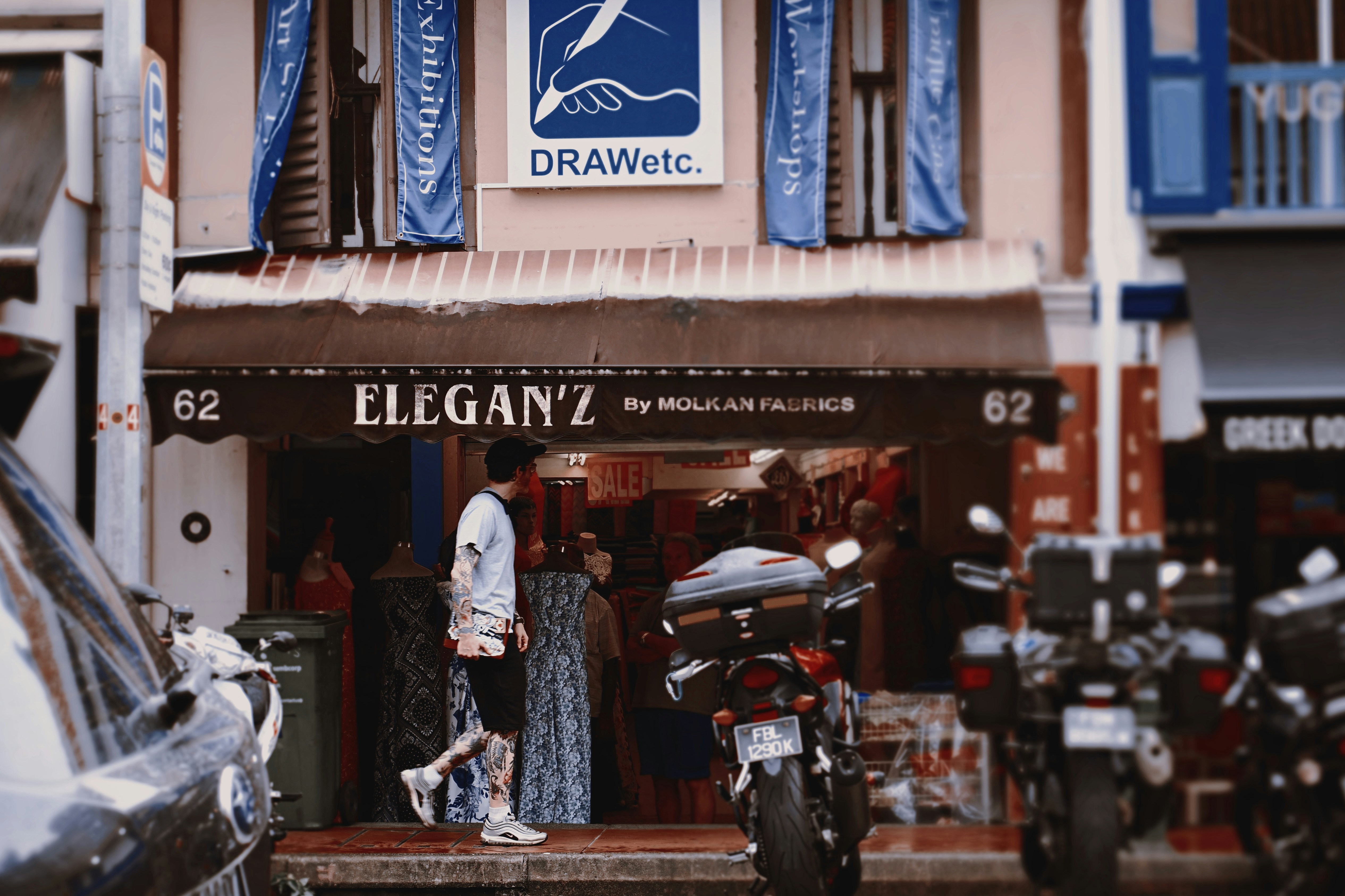 Storefront Portrait: A Casual Moment Outside Elegant'z Fashion Shop