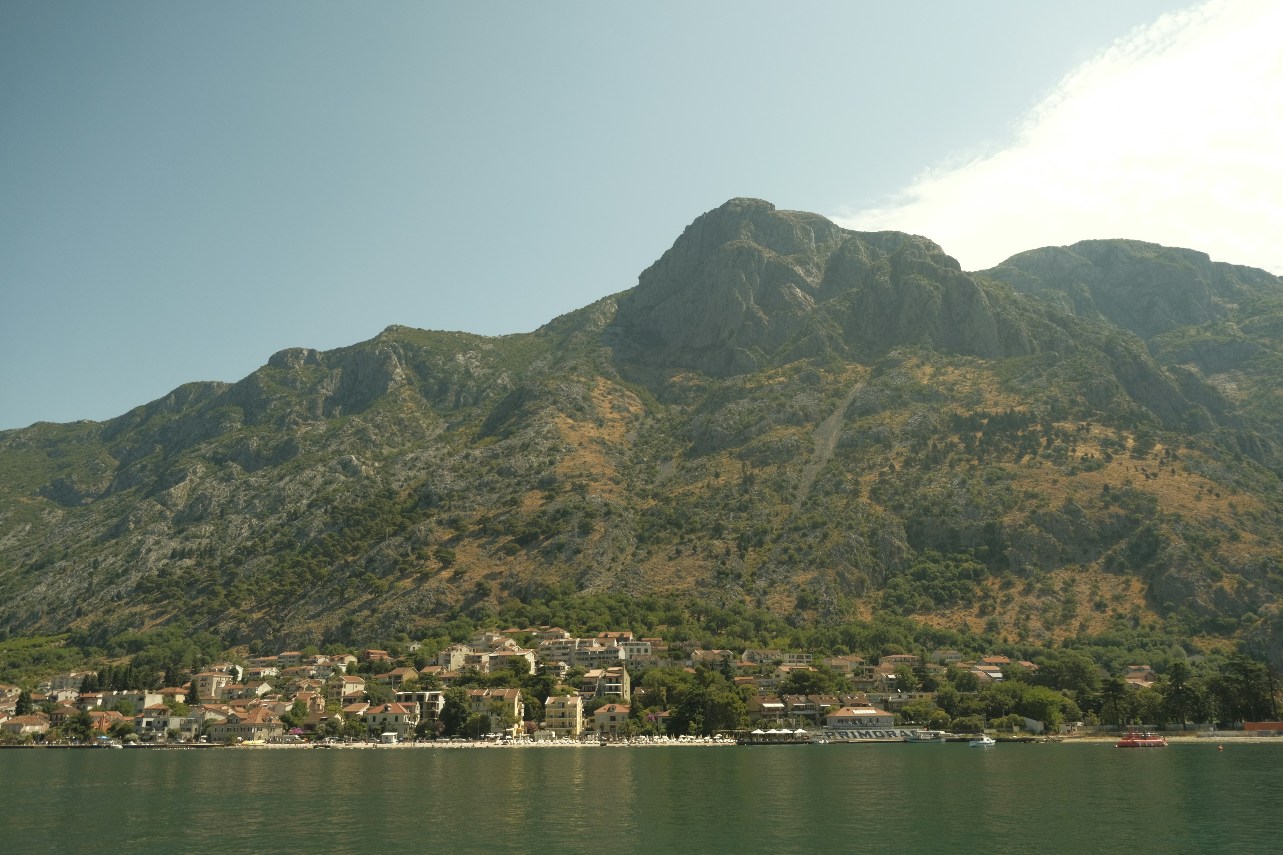 Stone Giants Over a Quiet Lakeside Village