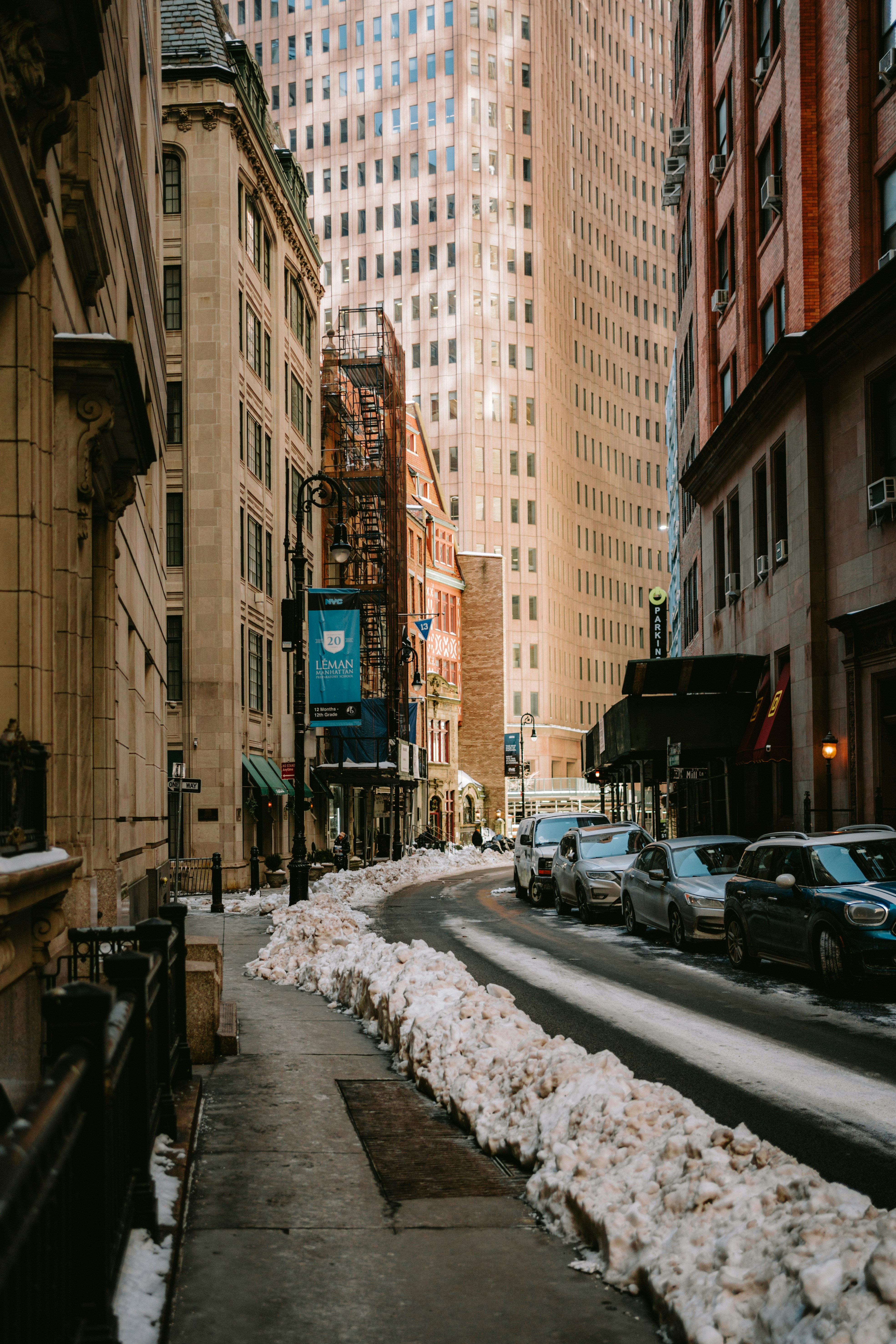 City Canyon in Winter: Snow Edges and Tall Facades