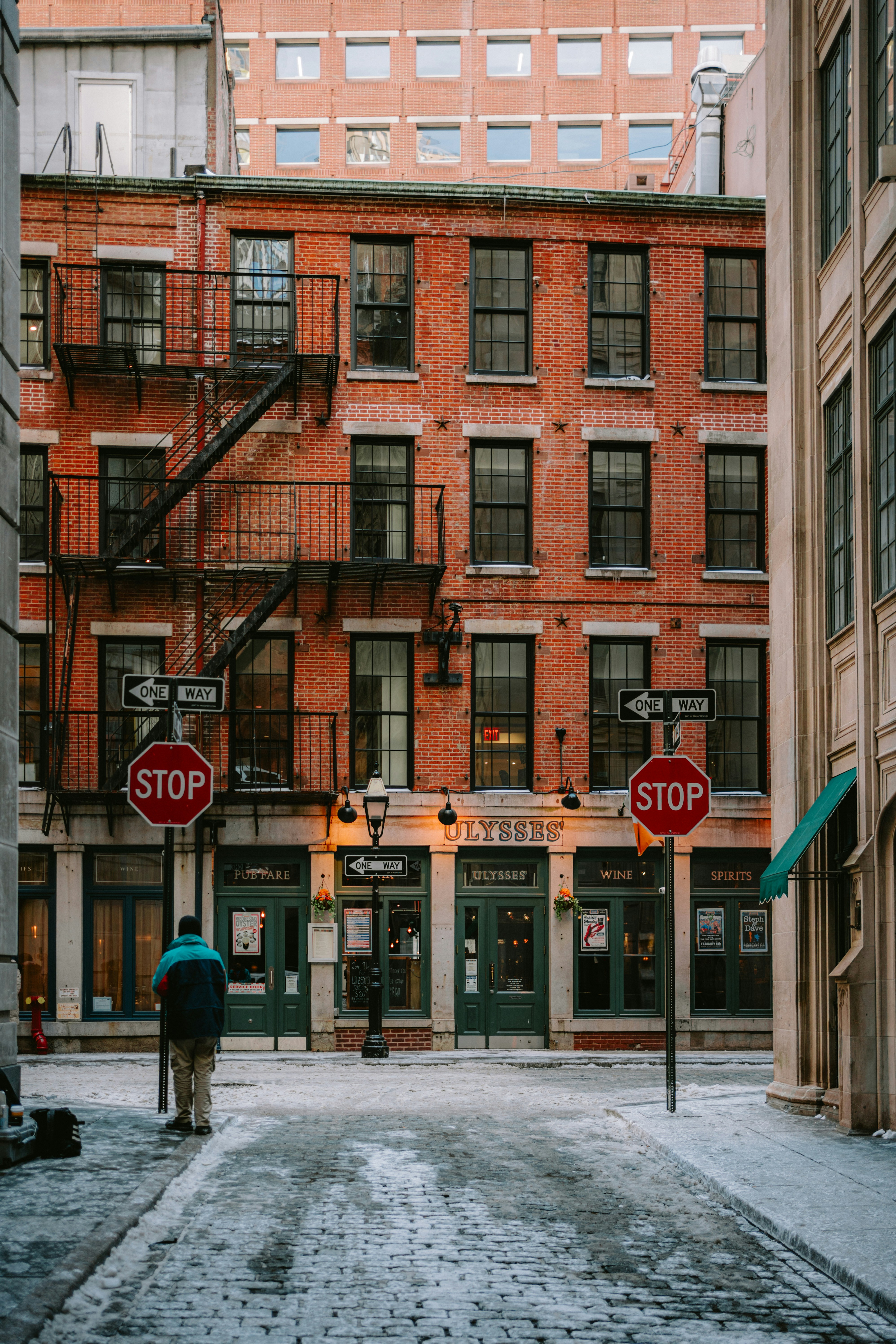 Brick Facade and Cobblestones: A City Moment at the Ulysses Shopfront