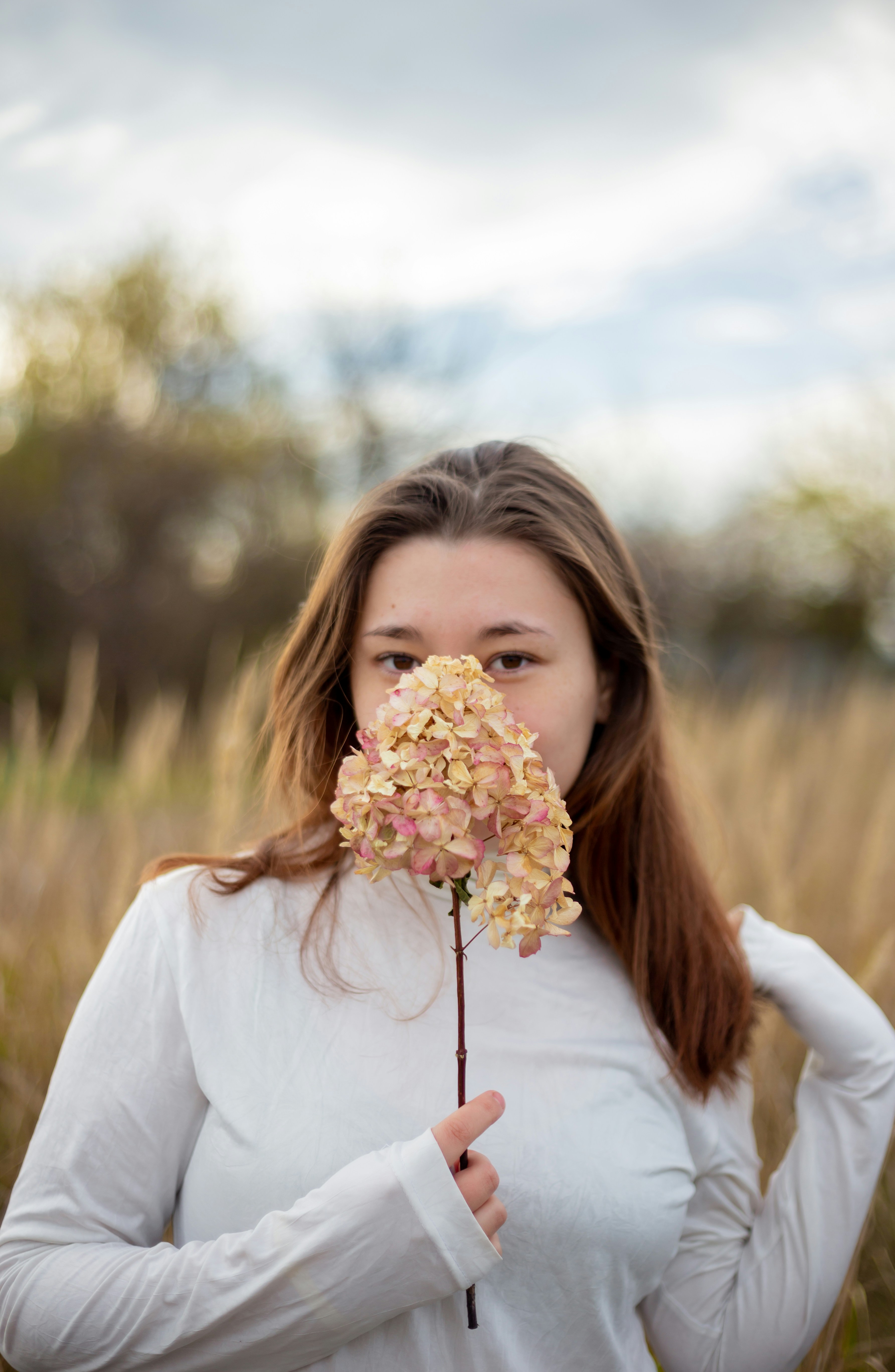 Pose with Hydrangea Veil: Soft Focus Portrait in Meadow