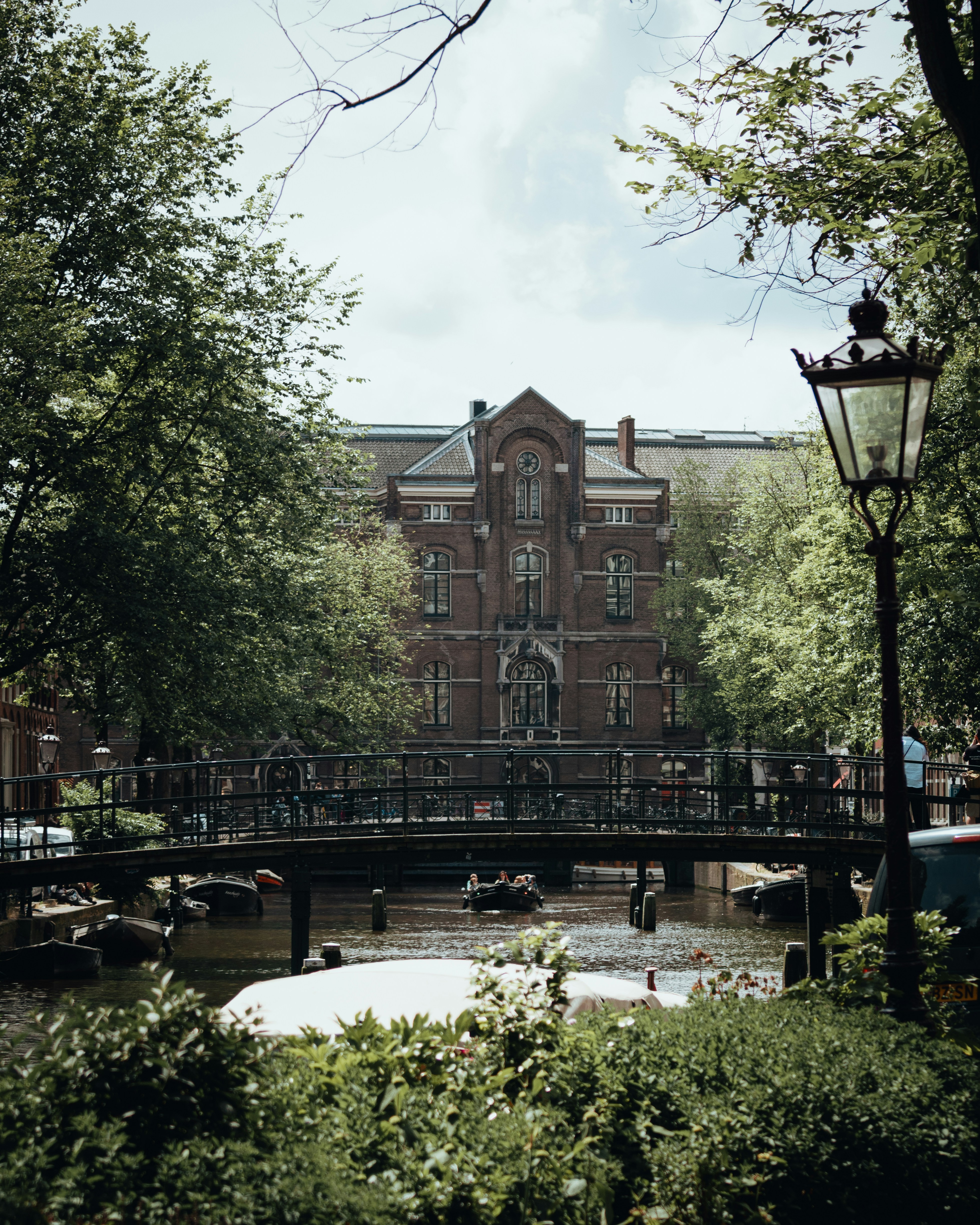 Brick Facade Over Water: A Canal Bridge in a Sunlit City