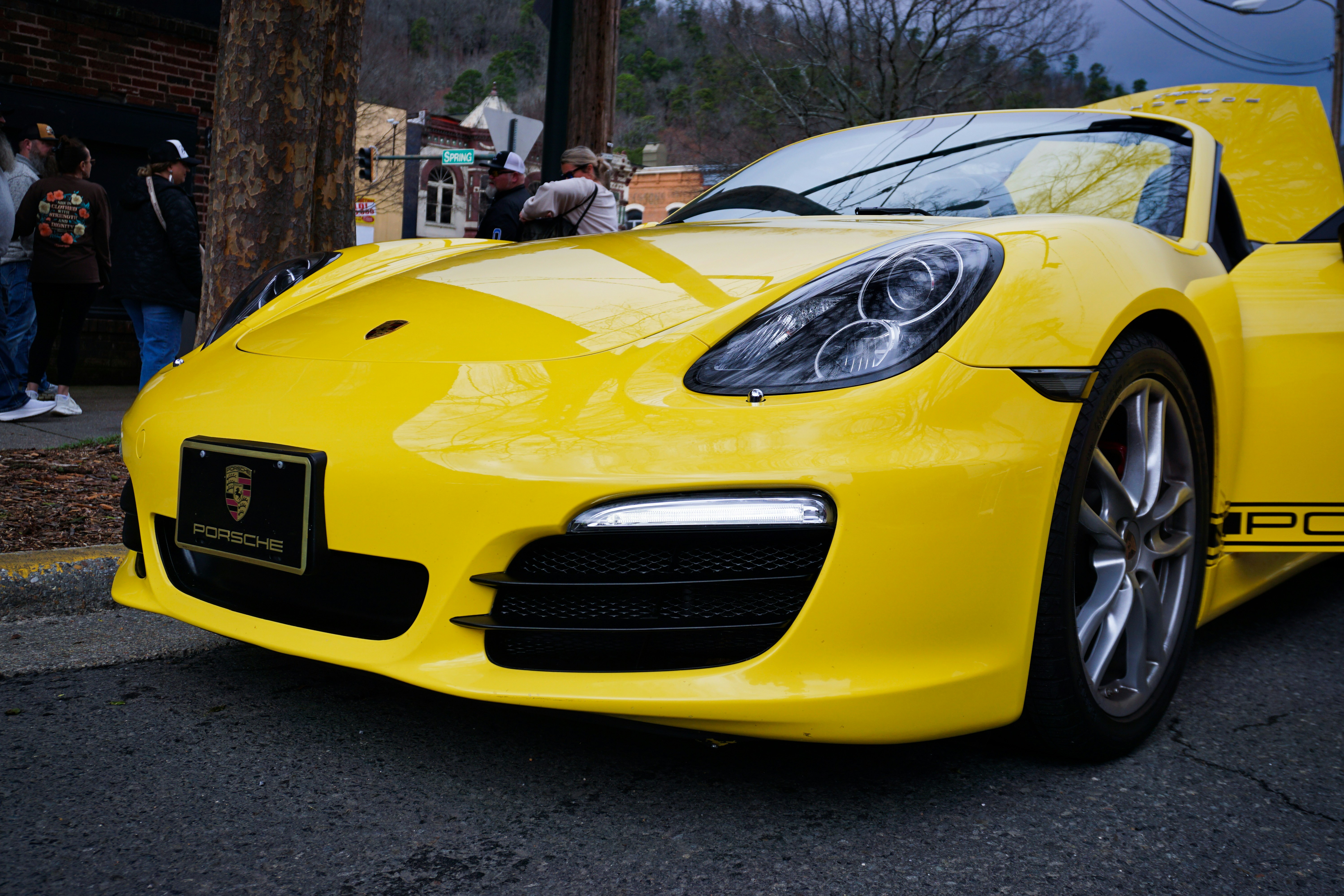 Aero Bloom: Yellow Porsche at a Show