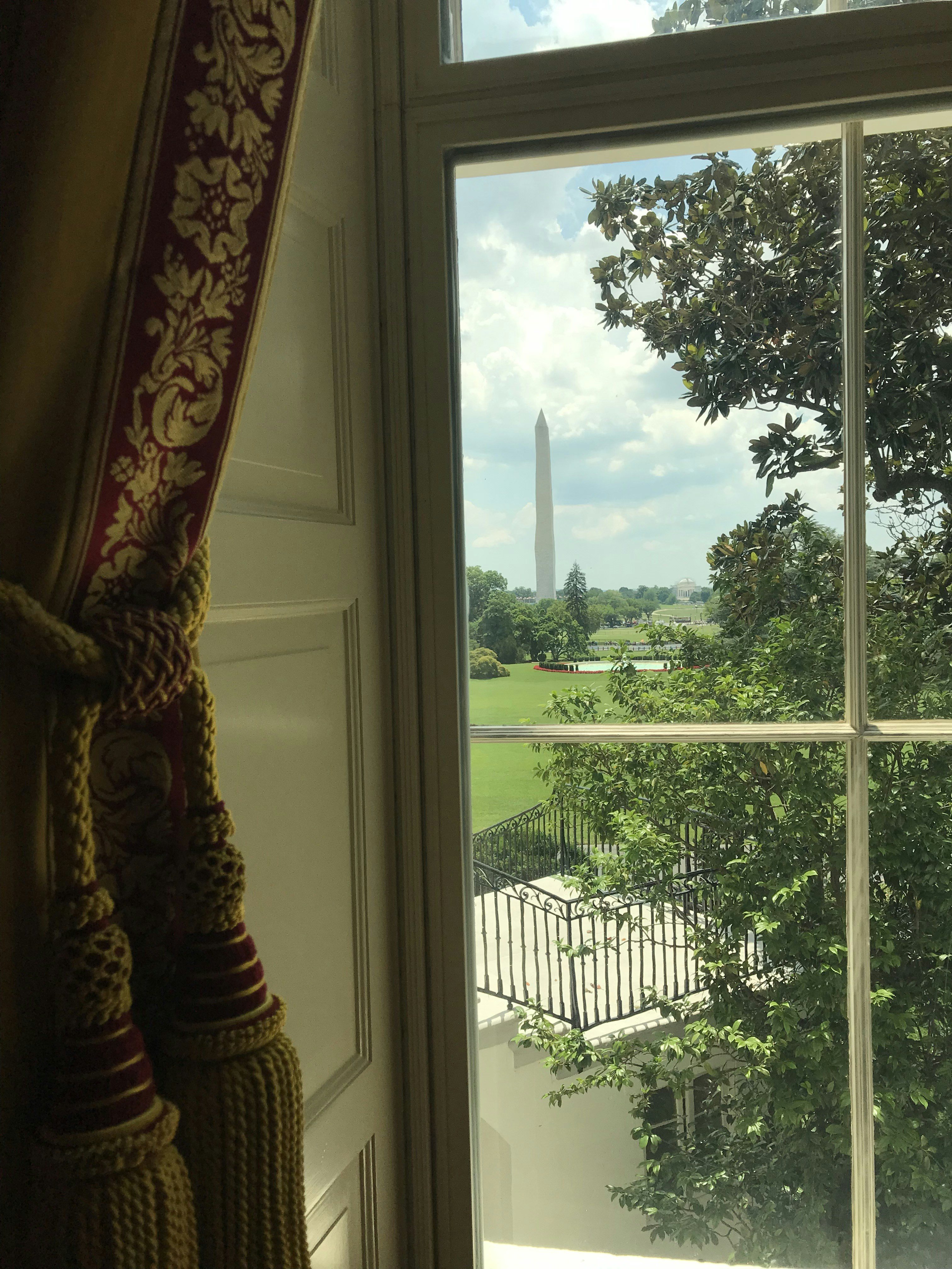 Sight from a Luxurious Window: The Washington Monument Peeking Through a Parisian Interior
