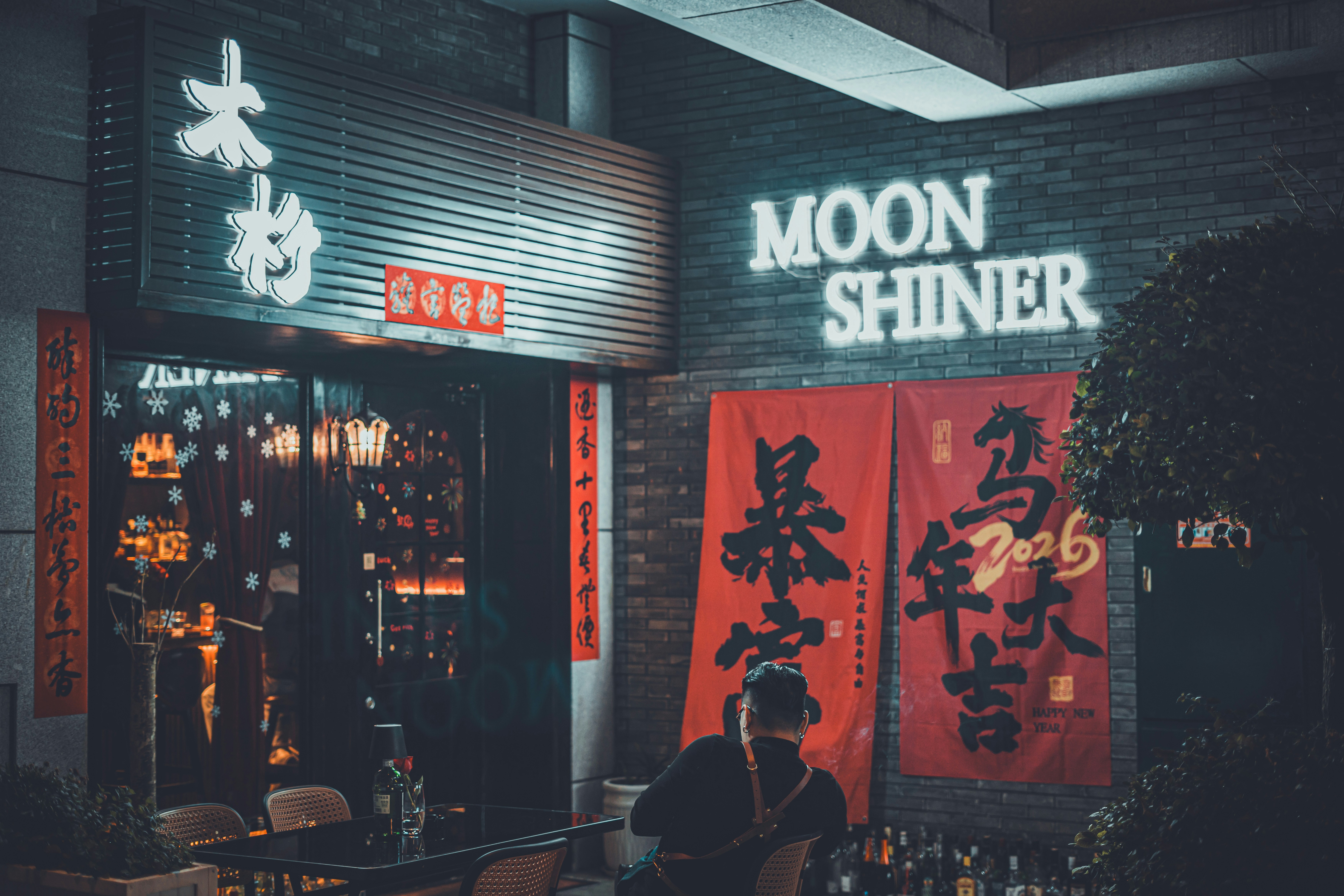 Moon Shiner Neon, Red Lanterns, and Quiet Patrons