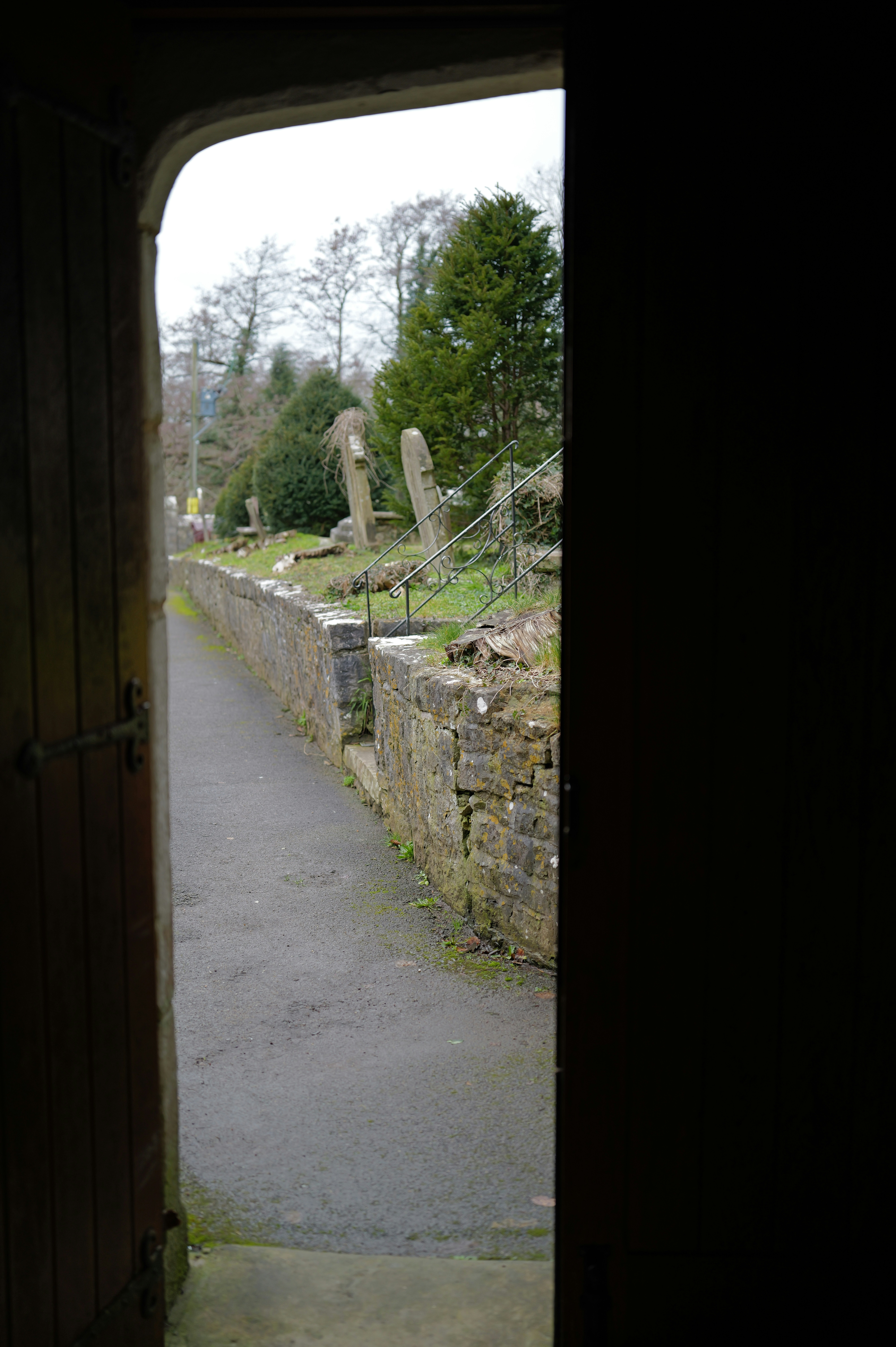 Threshold to the past: a quiet doorway toward the village path