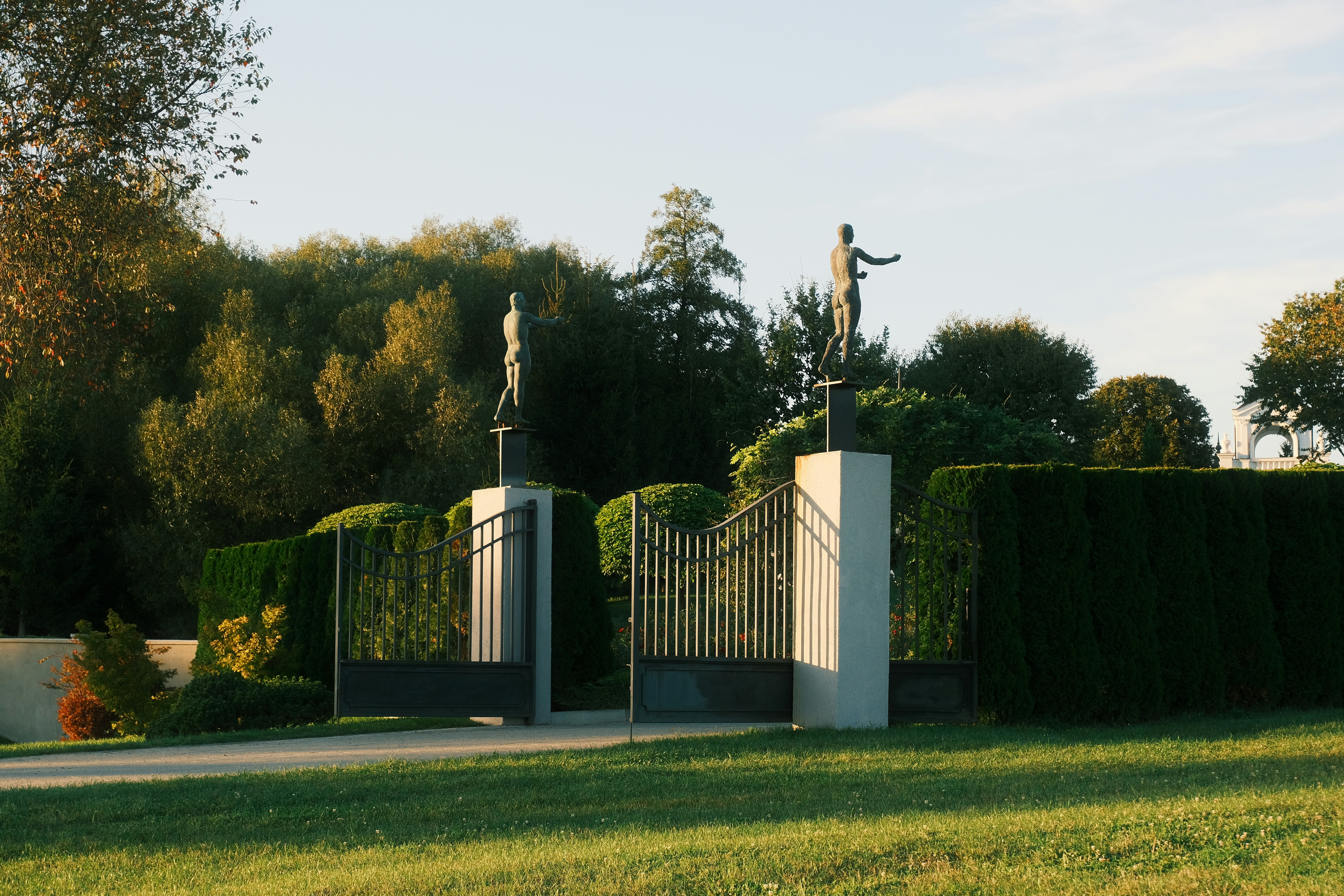 Statues Holding Court: Gates of a Quiet Park