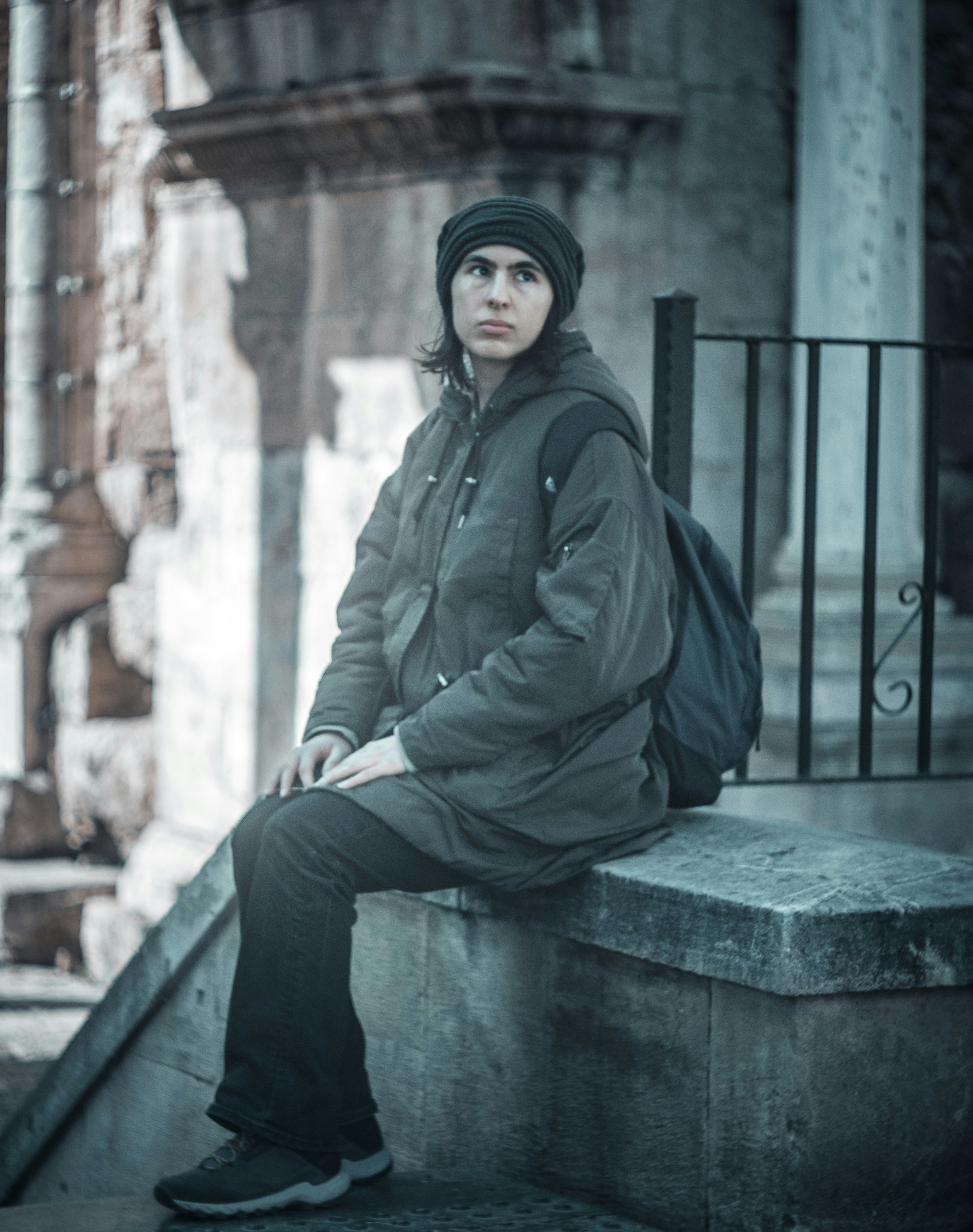 Harboring Quiet Resolve: A Street Portrait in Cold Light