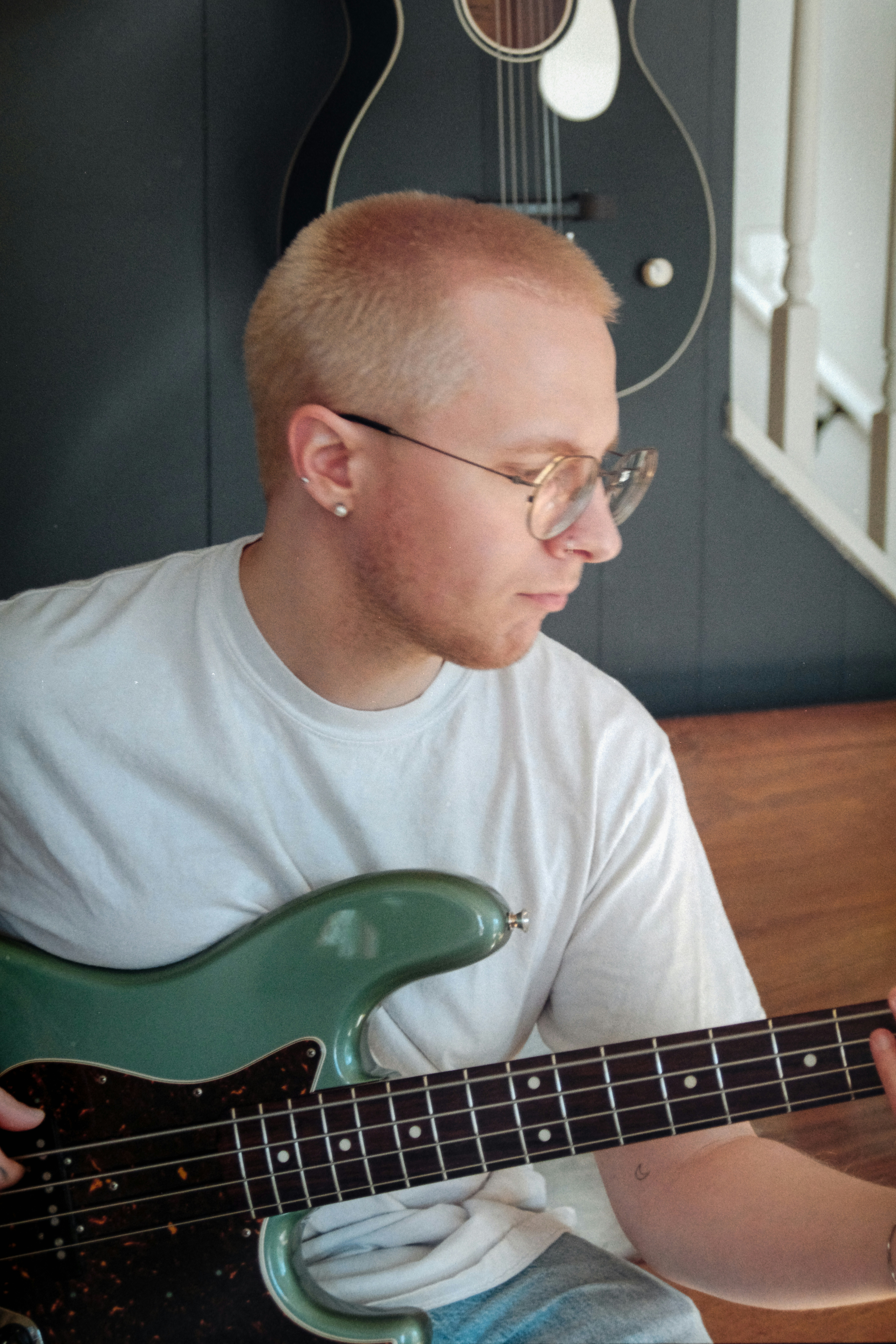 Guitar Study: Focused Portrait of a Player in a Quiet Corner