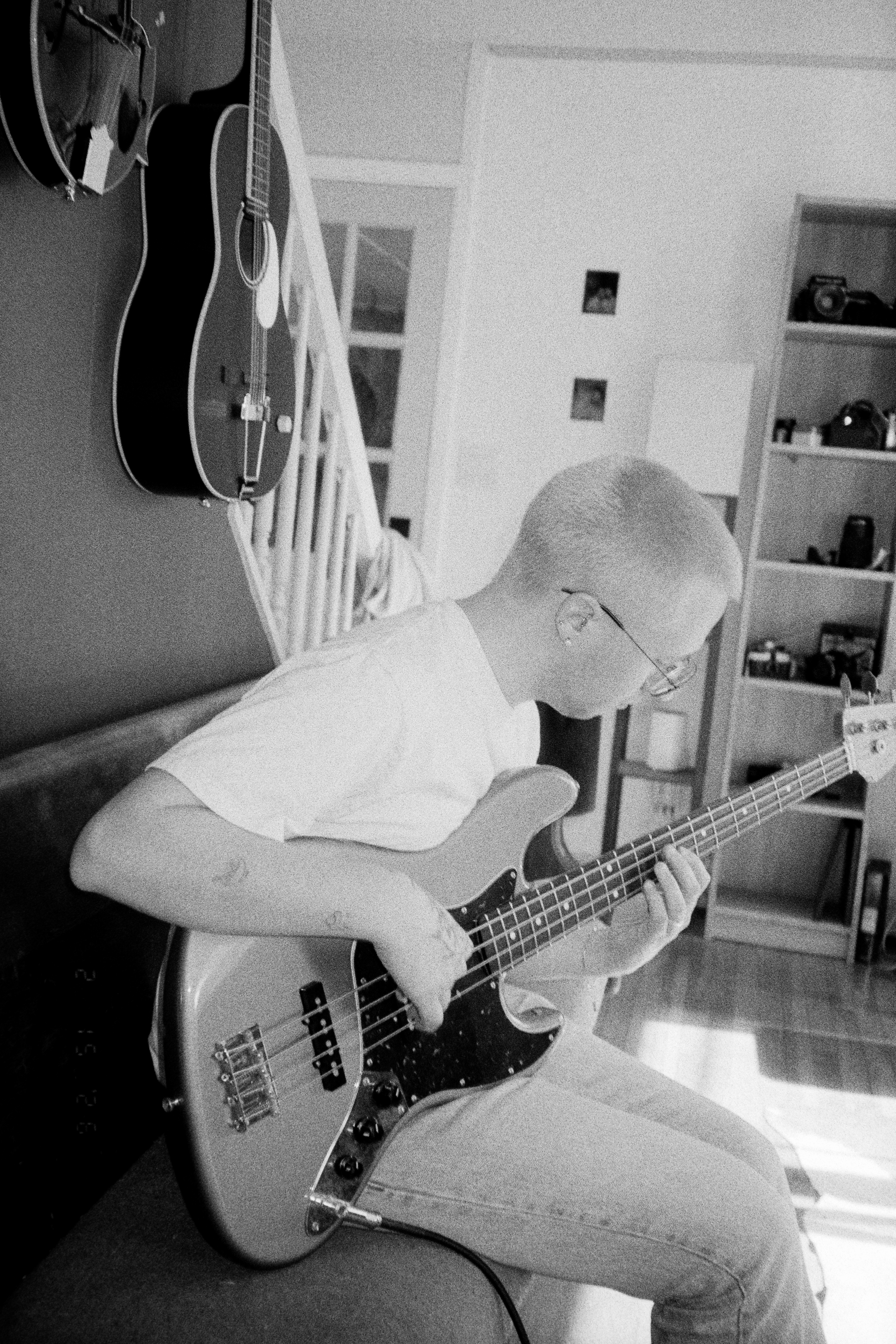 Muted Metal: A guitarist in a sunlit room finds focus on the fretboard