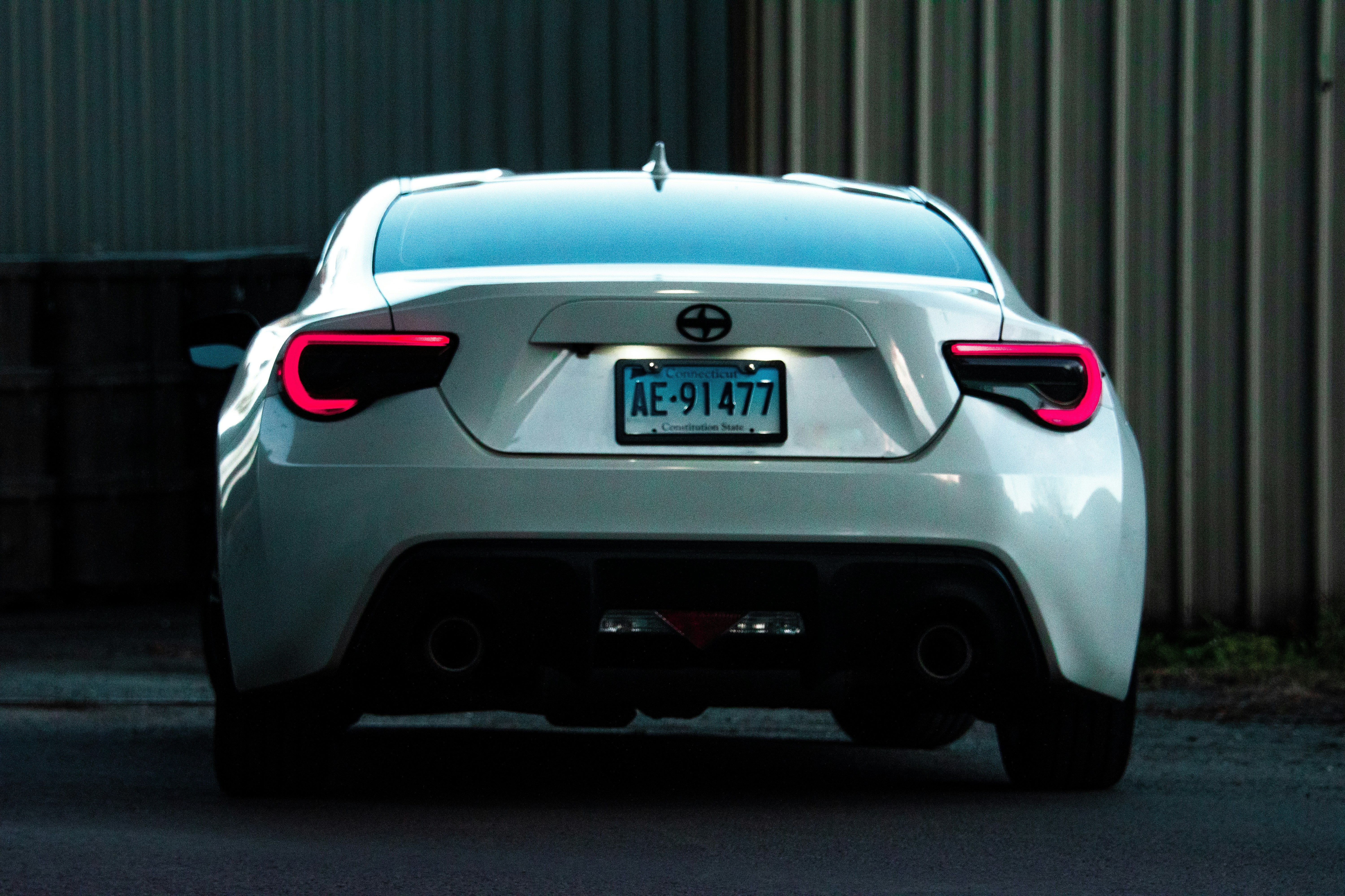 Rearview Symmetry: A Toyota in Quiet Sunset Tones