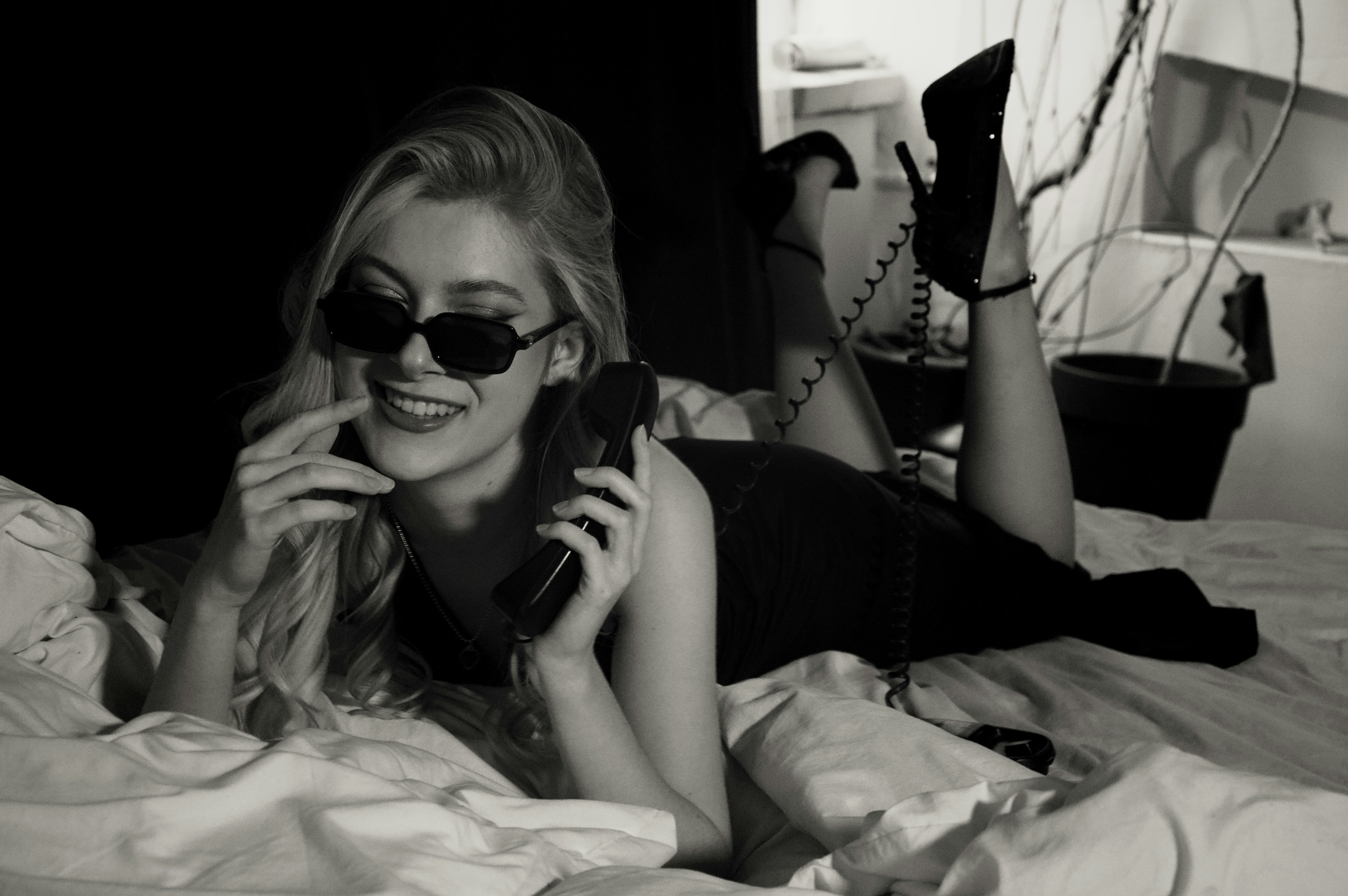 Glamour on the Bed: A Lively Call from the Landline