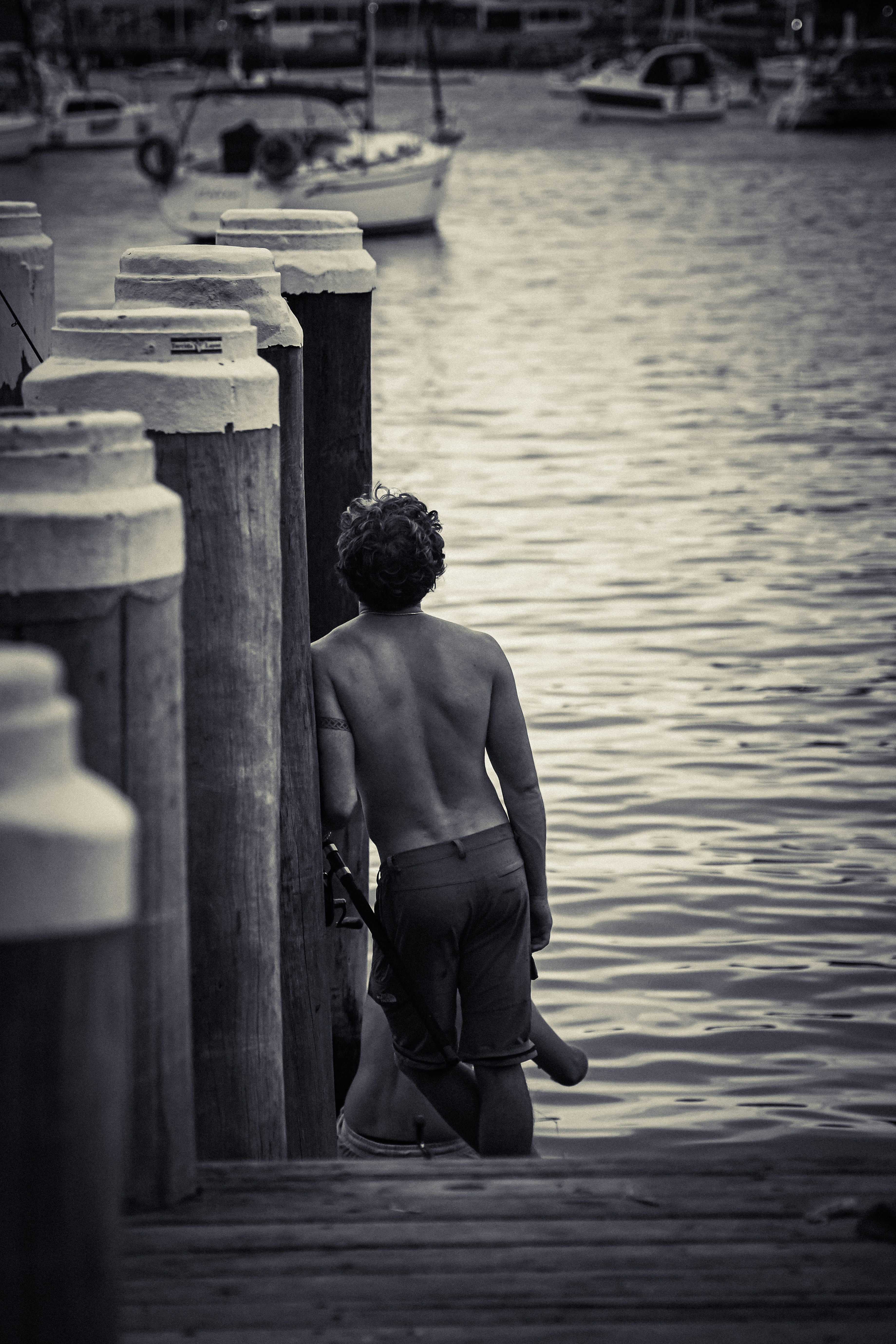 Where the Water Holds Still: A Silhouette by the Pier