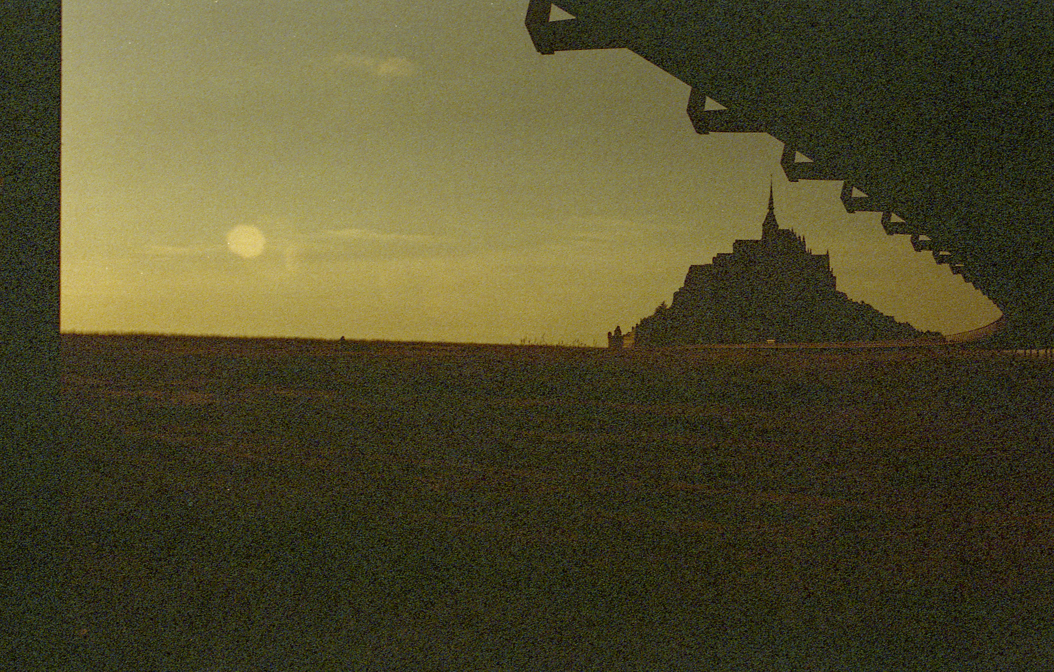 Castle silhouette on a hill at sunset