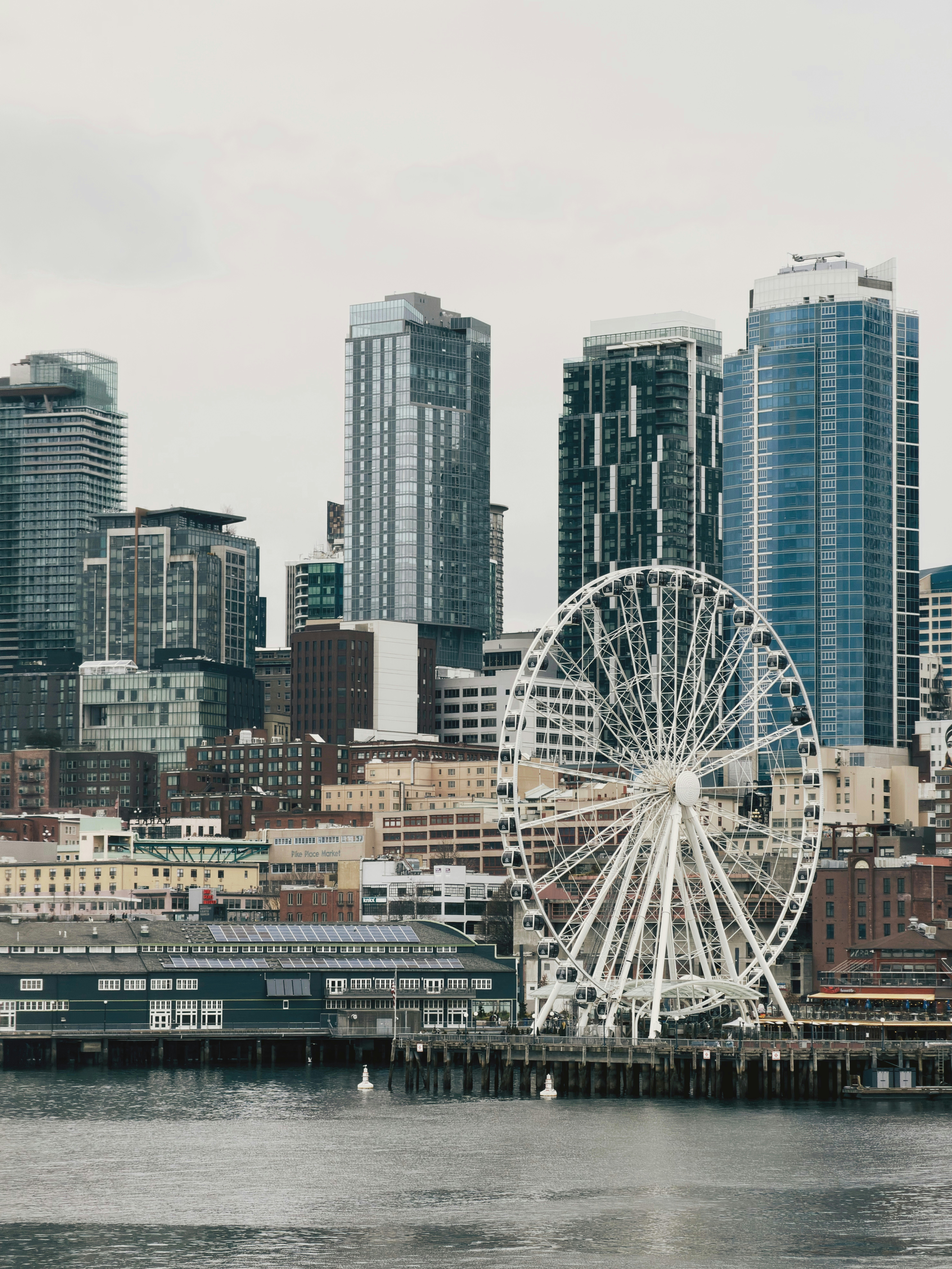 Ferris Wheel Over Waterfront Skyline